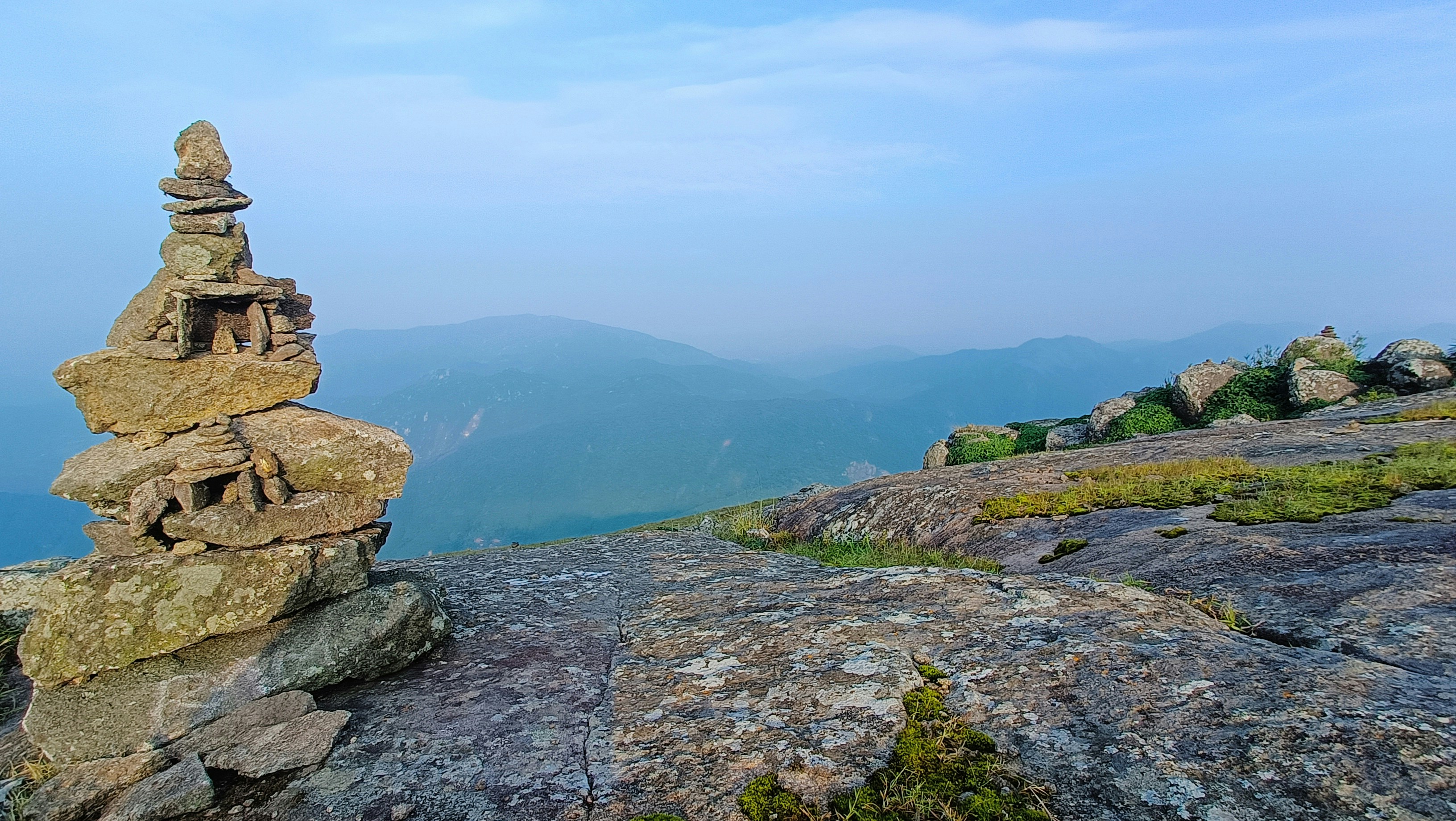 A stack of rocks sitting on top of a mountain photo – Free India Image ...
