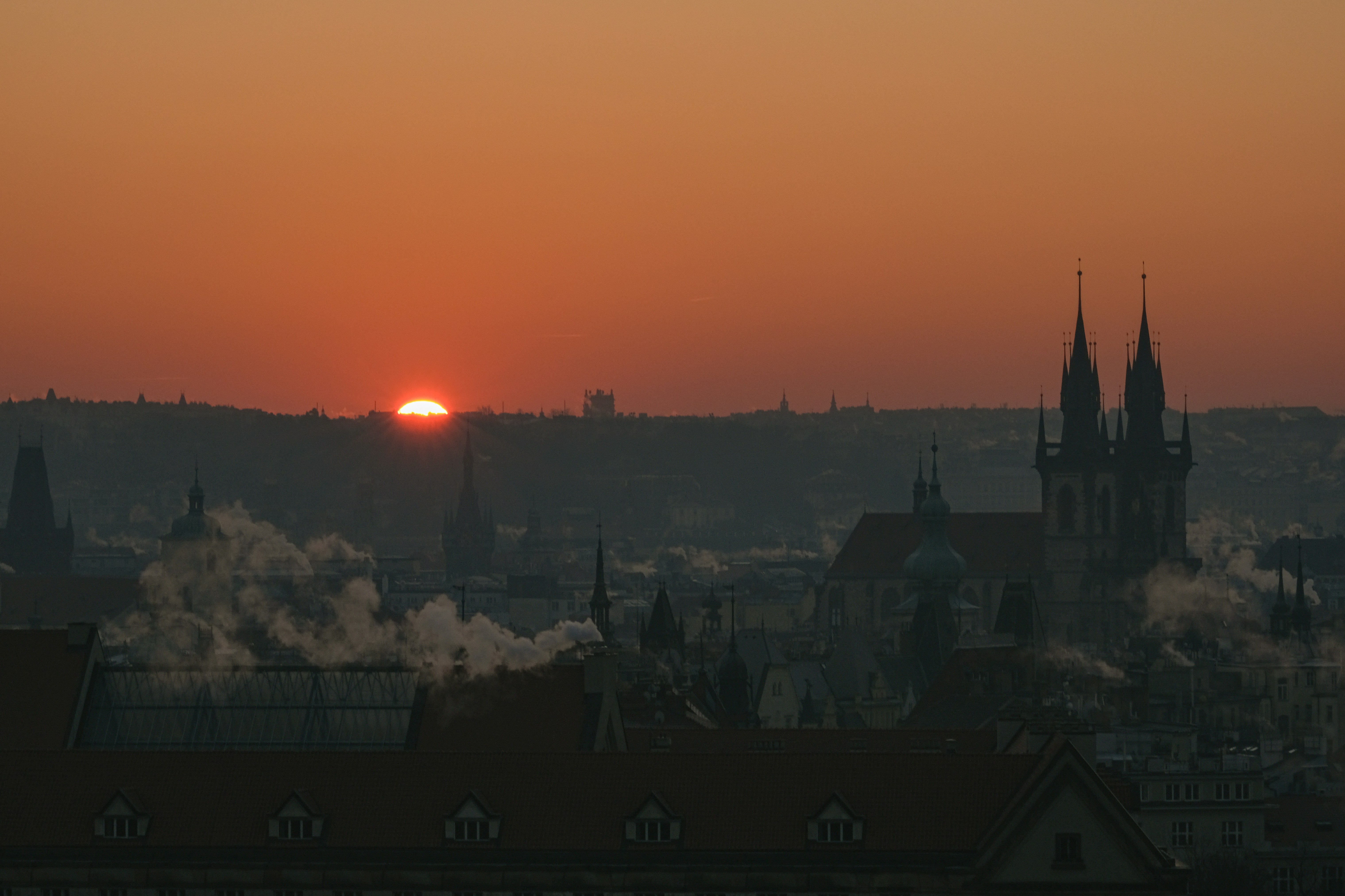 Dusk Over Prague: Sunset Silhouette Against Gothic Spires