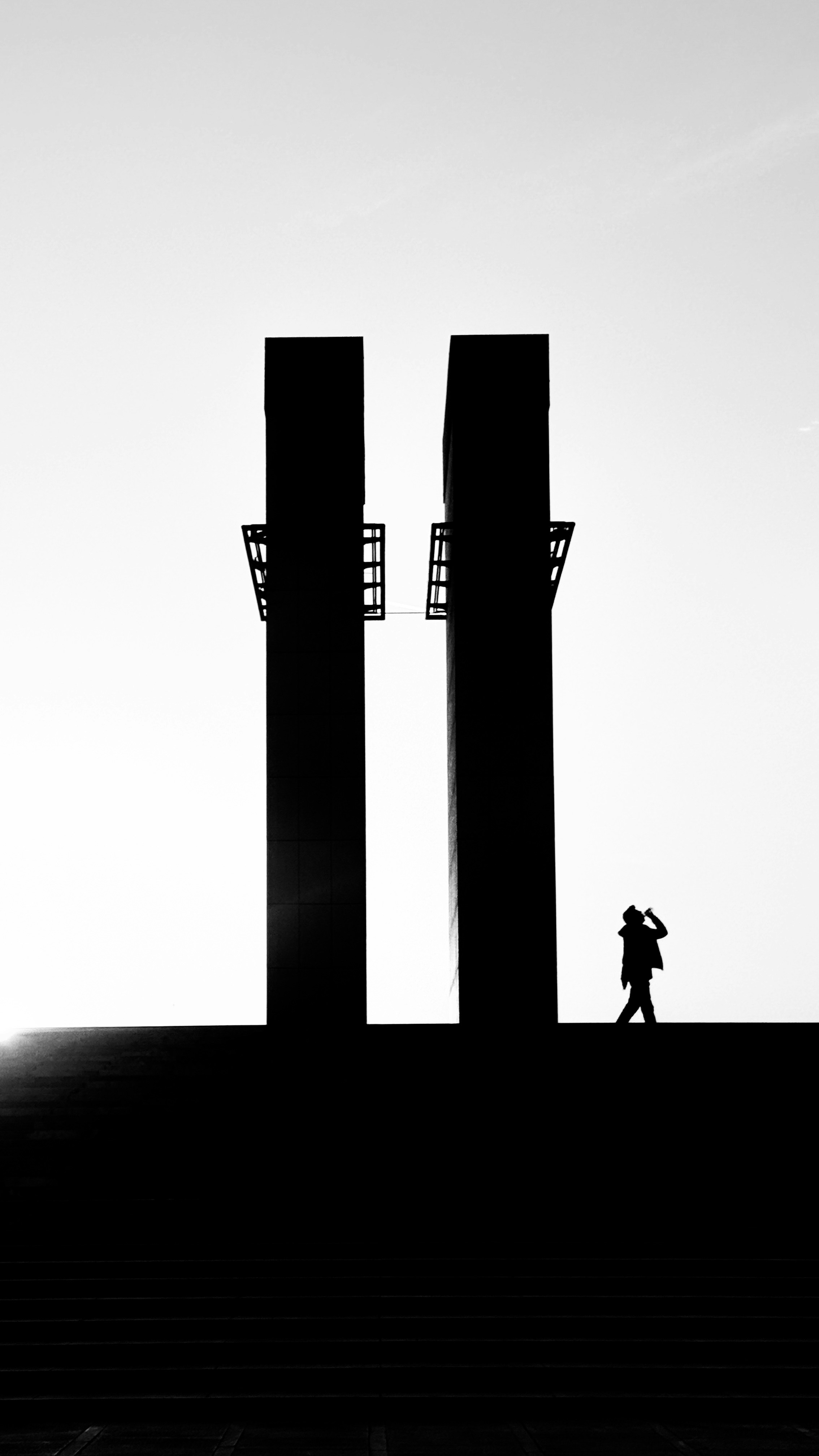 Silhouetted Hands and Towers: A Minimal Stairway to Quiet Distance