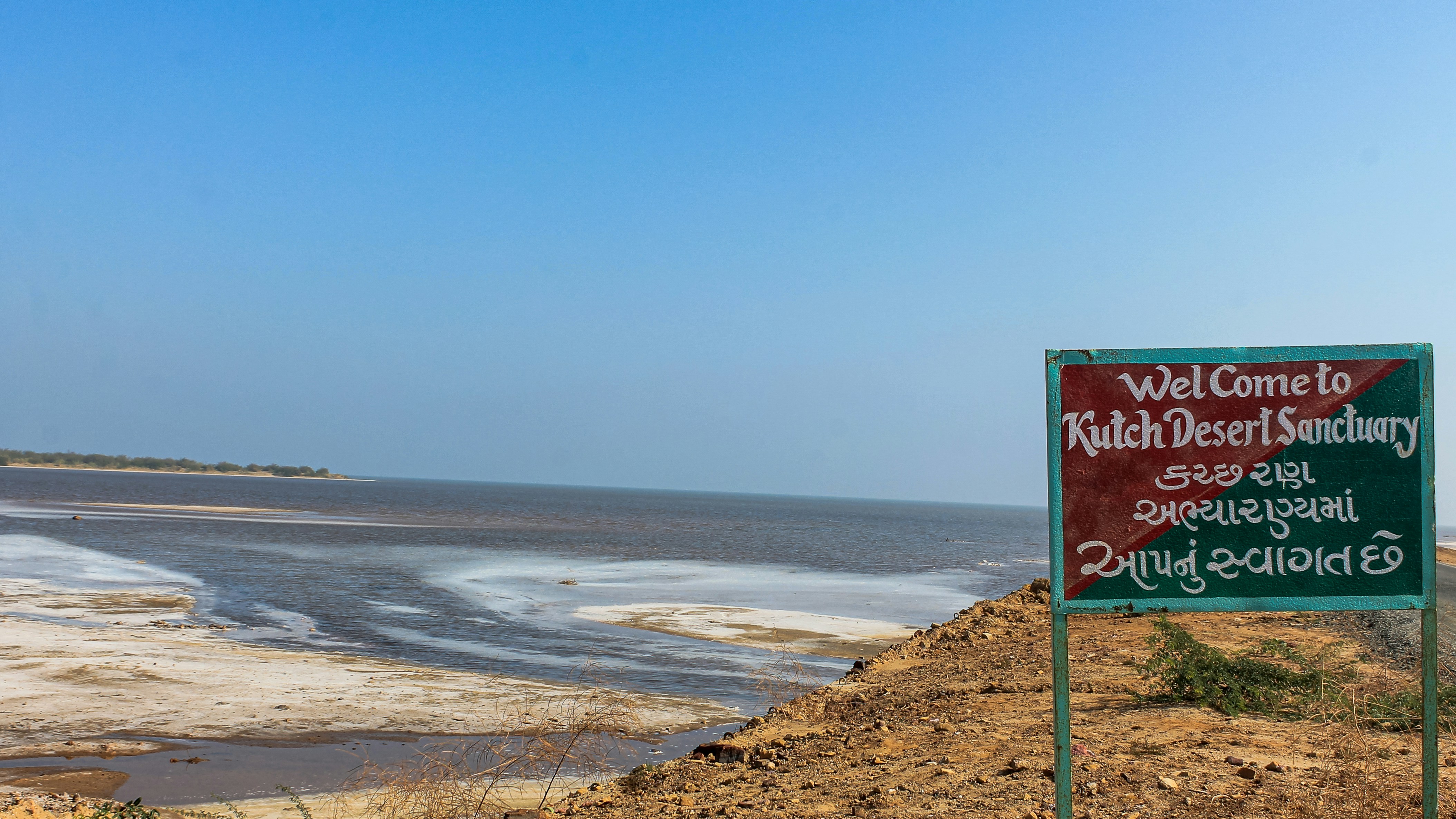 A welcome sign on the side of a beach photo – Free Gujarat Image on ...