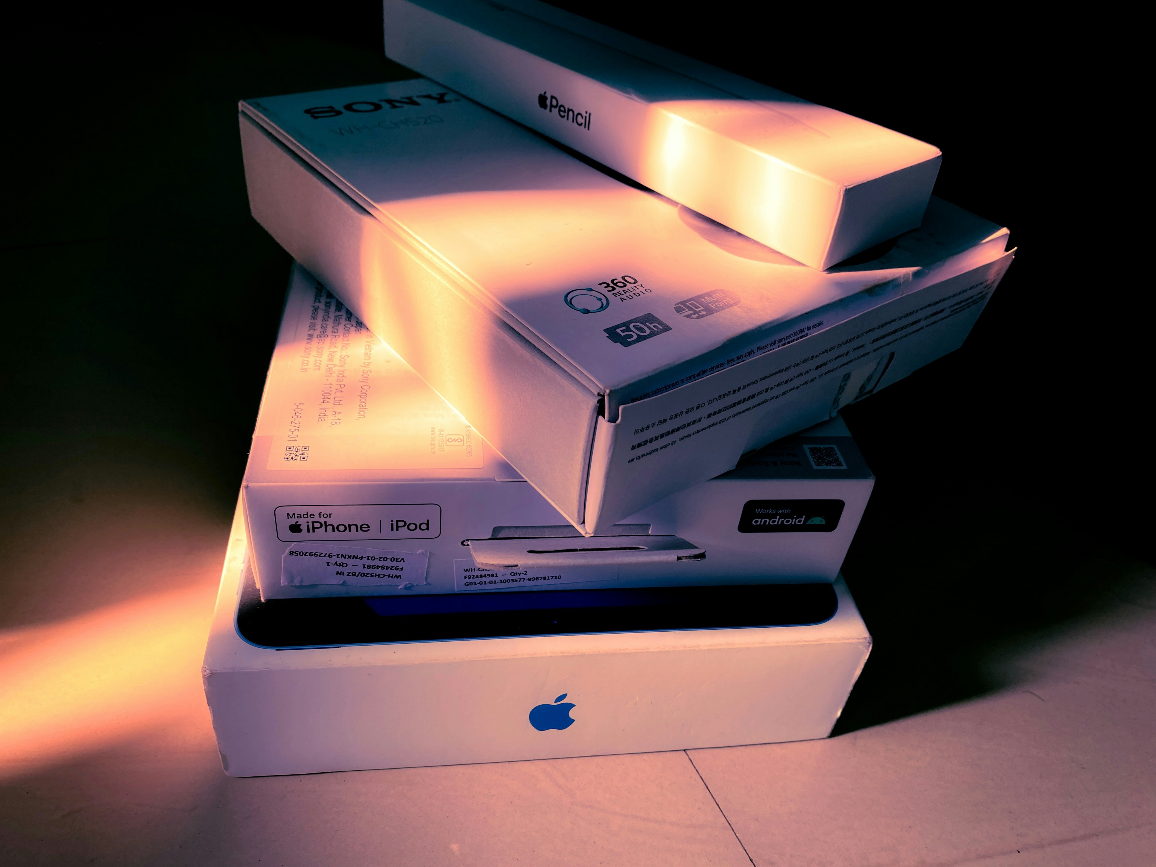 A stack of boxes sitting on top of each other photo – Free Electronics ...
