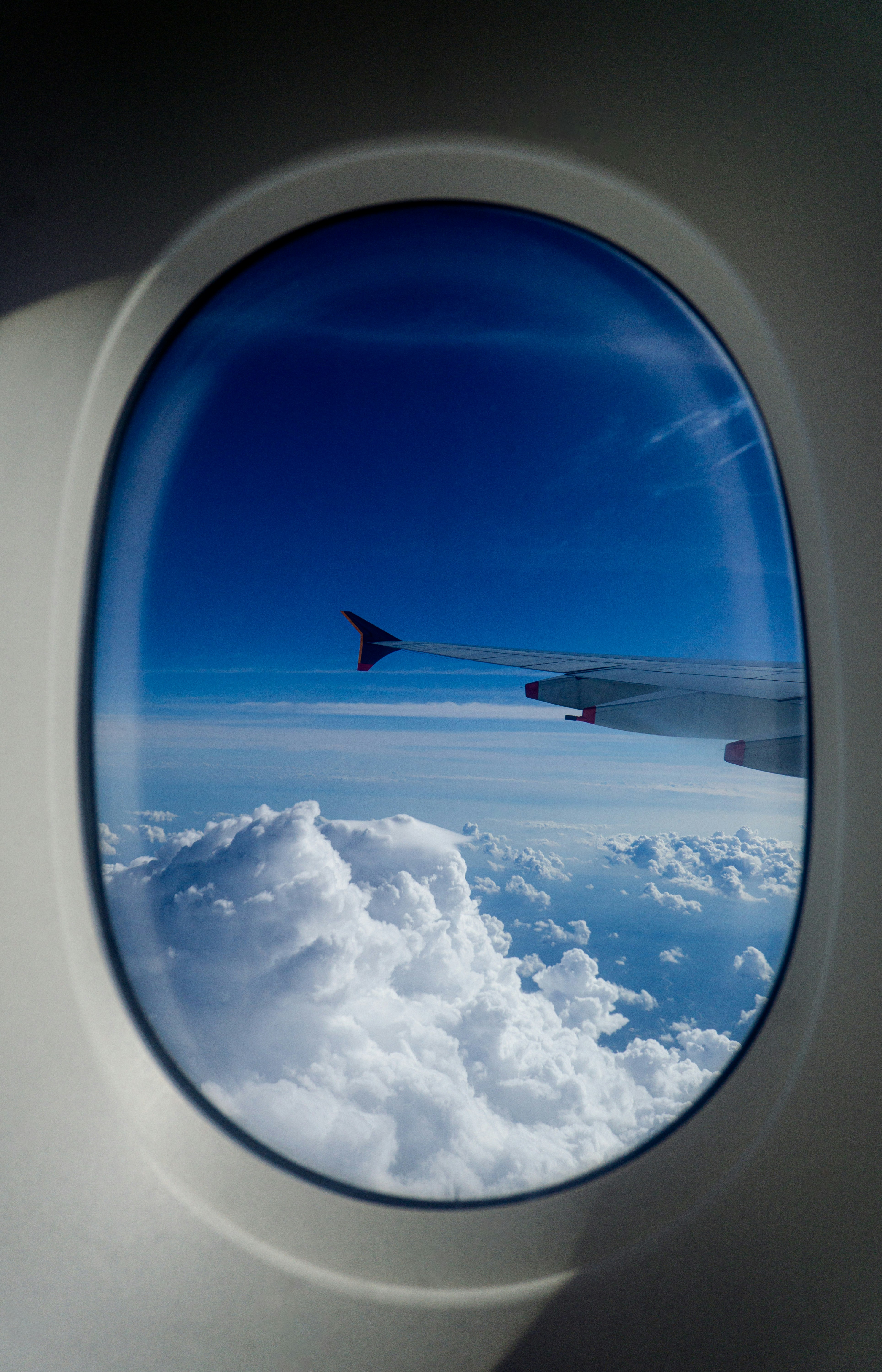 A view of the wing of an airplane through a window photo – Free Travel ...