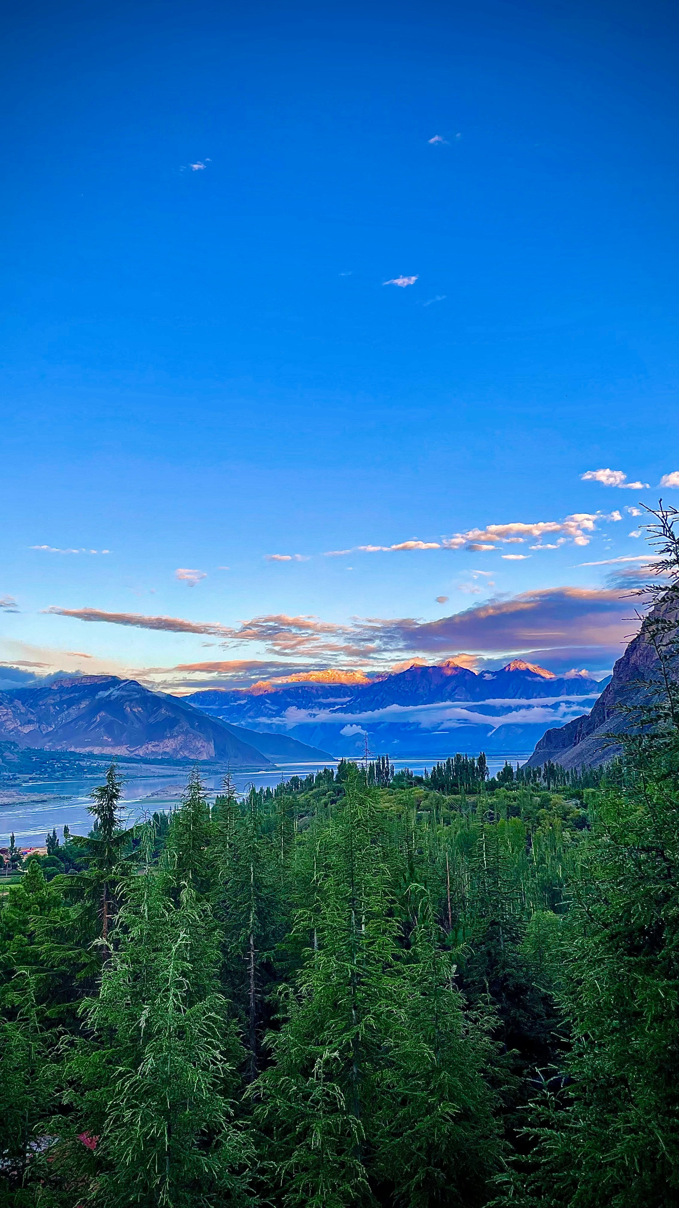 Cedar Crest Over Lake: Dawn Light on Snowy Peaks