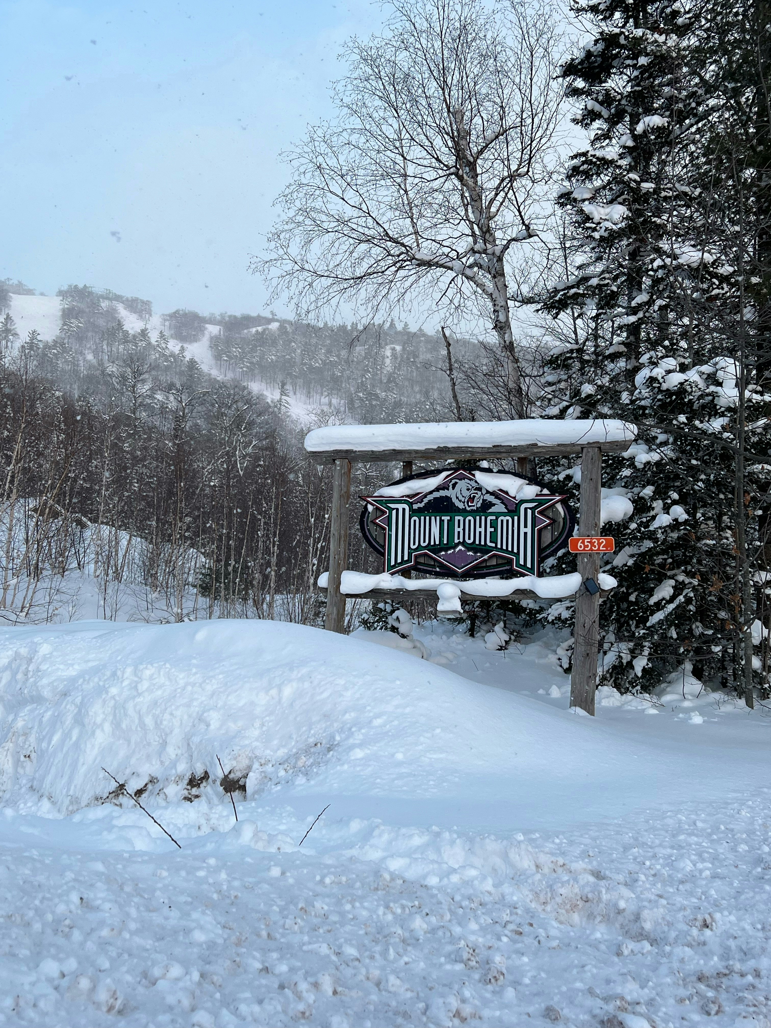 Snowbound Welcome: Mont Bolem Sign Amid Winter Quiet