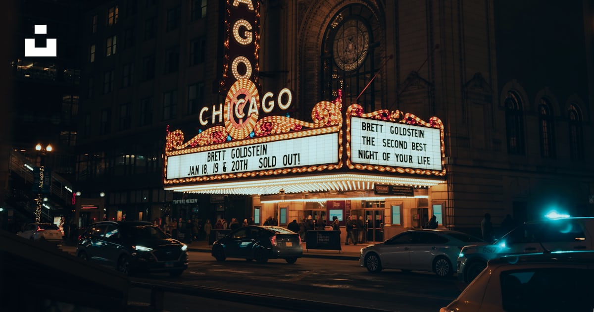 A Theater Marquee Lit Up At Night Photo Free Chicago Image On Unsplash