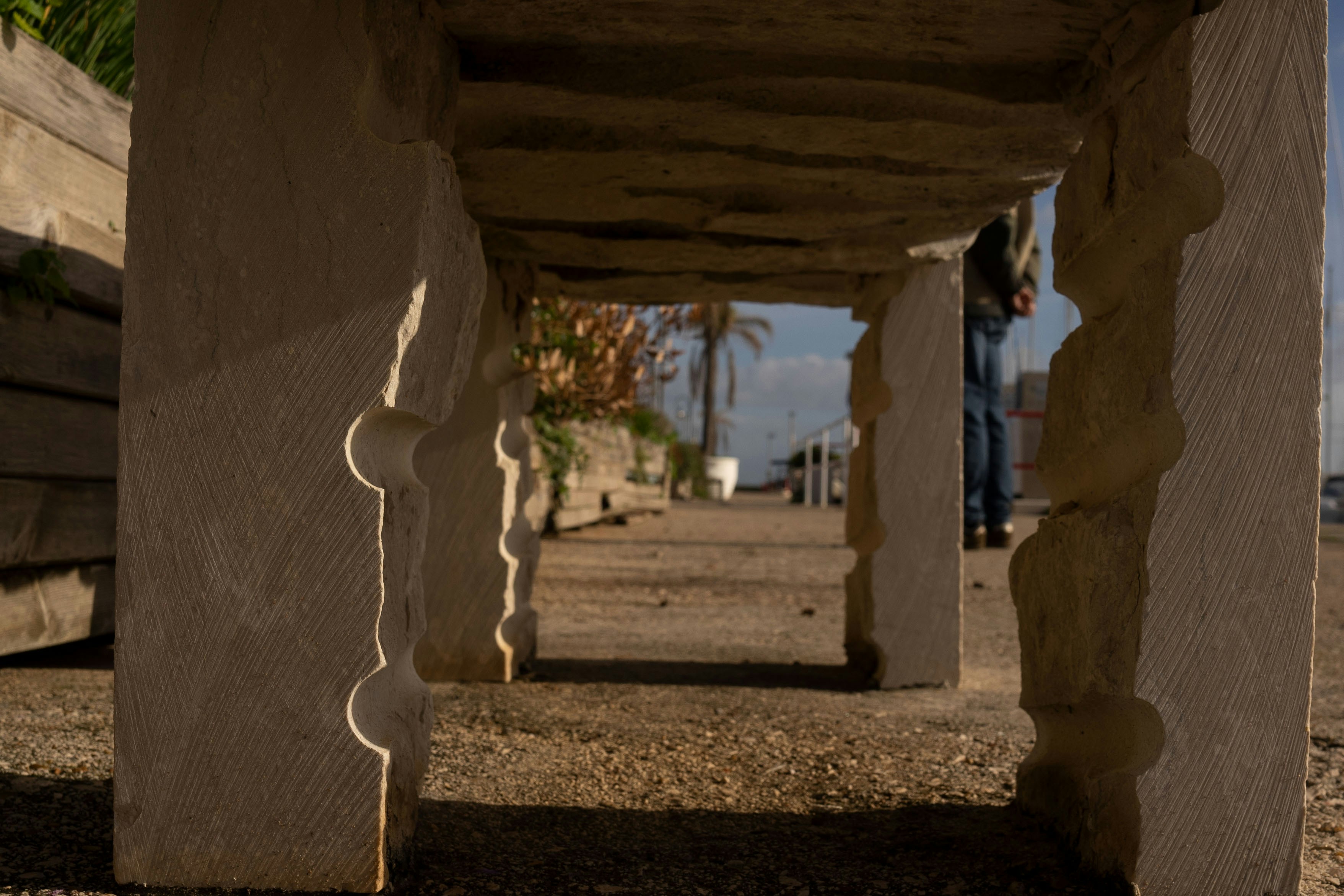 Under the Seaside Bench: A Ground-Level Corridor Leading to the Horizon