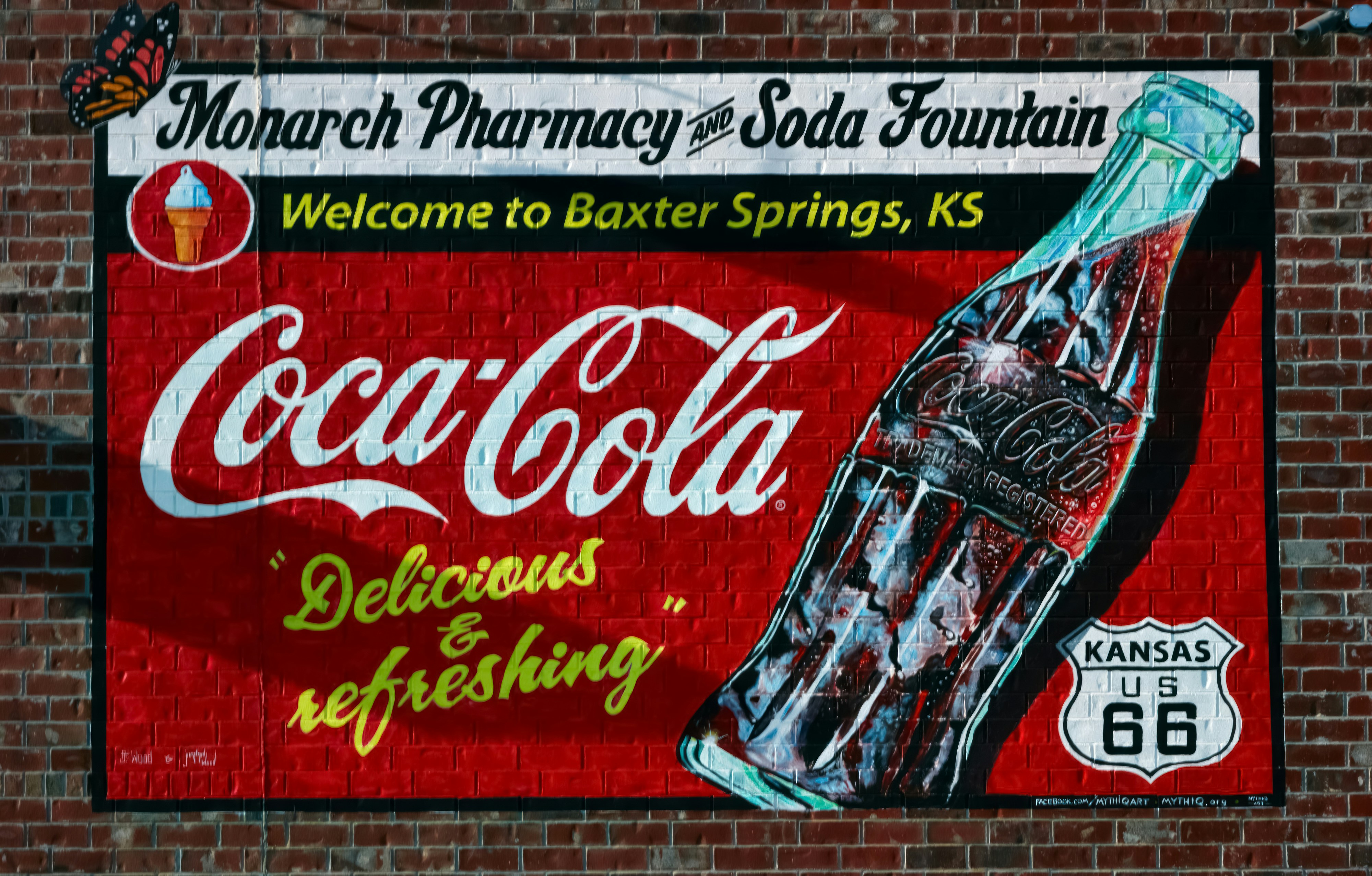 A combination welcome and vintage Coca-Cola sign in Baxter Springs ...