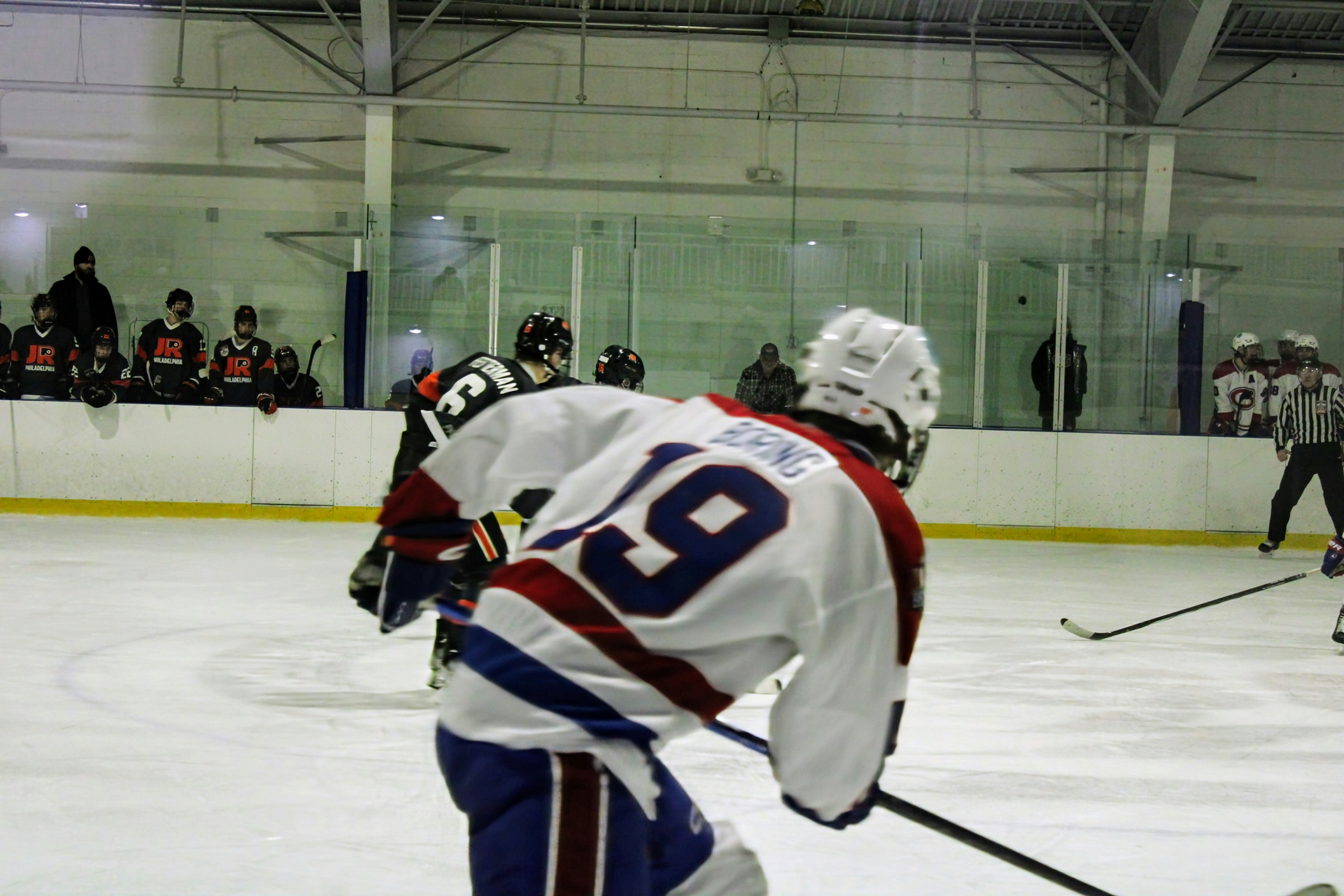 Breakaway in White: A Fast-Paced Rush Across the Ice