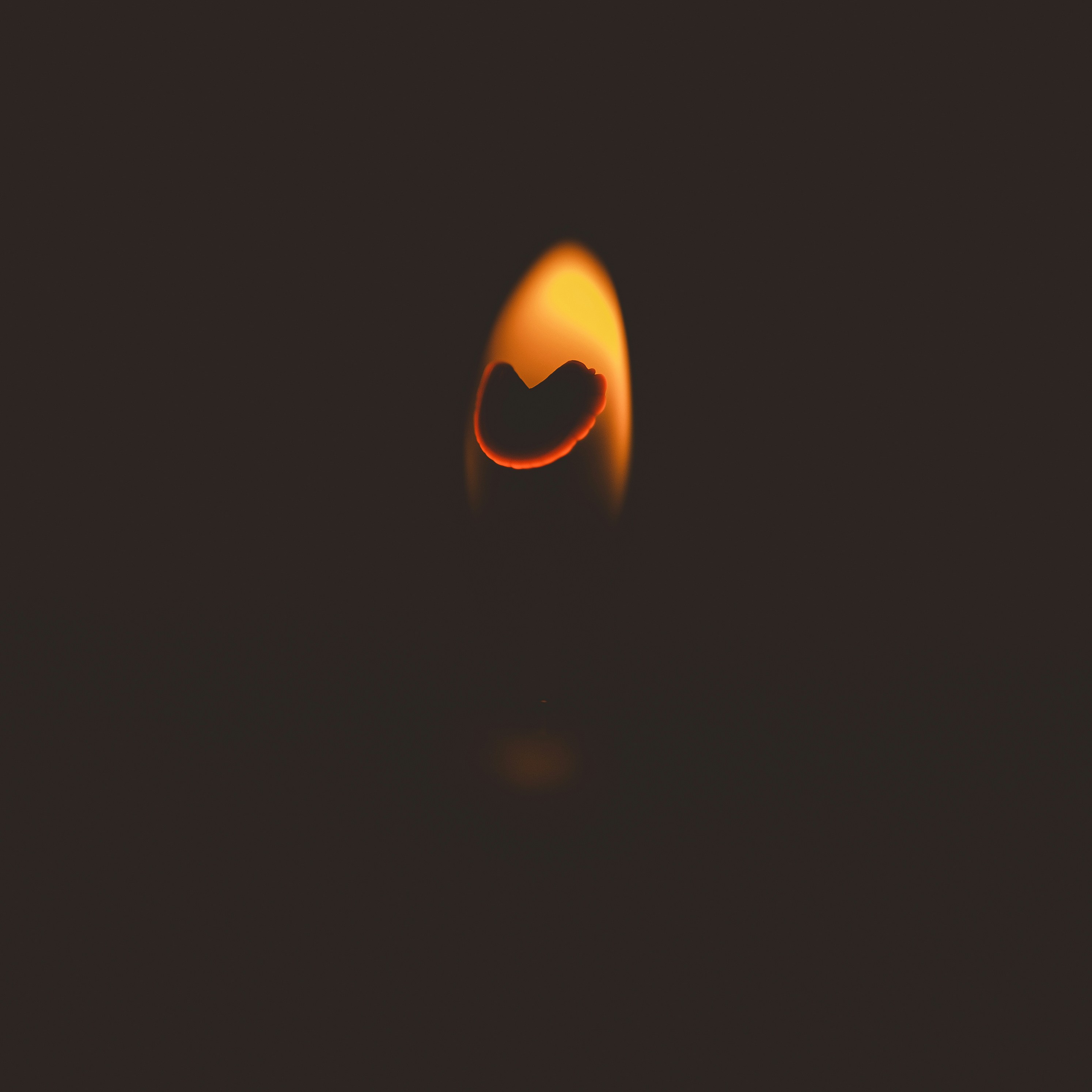 Centered Ember: A Minimal Candle Surrounded by Darkness