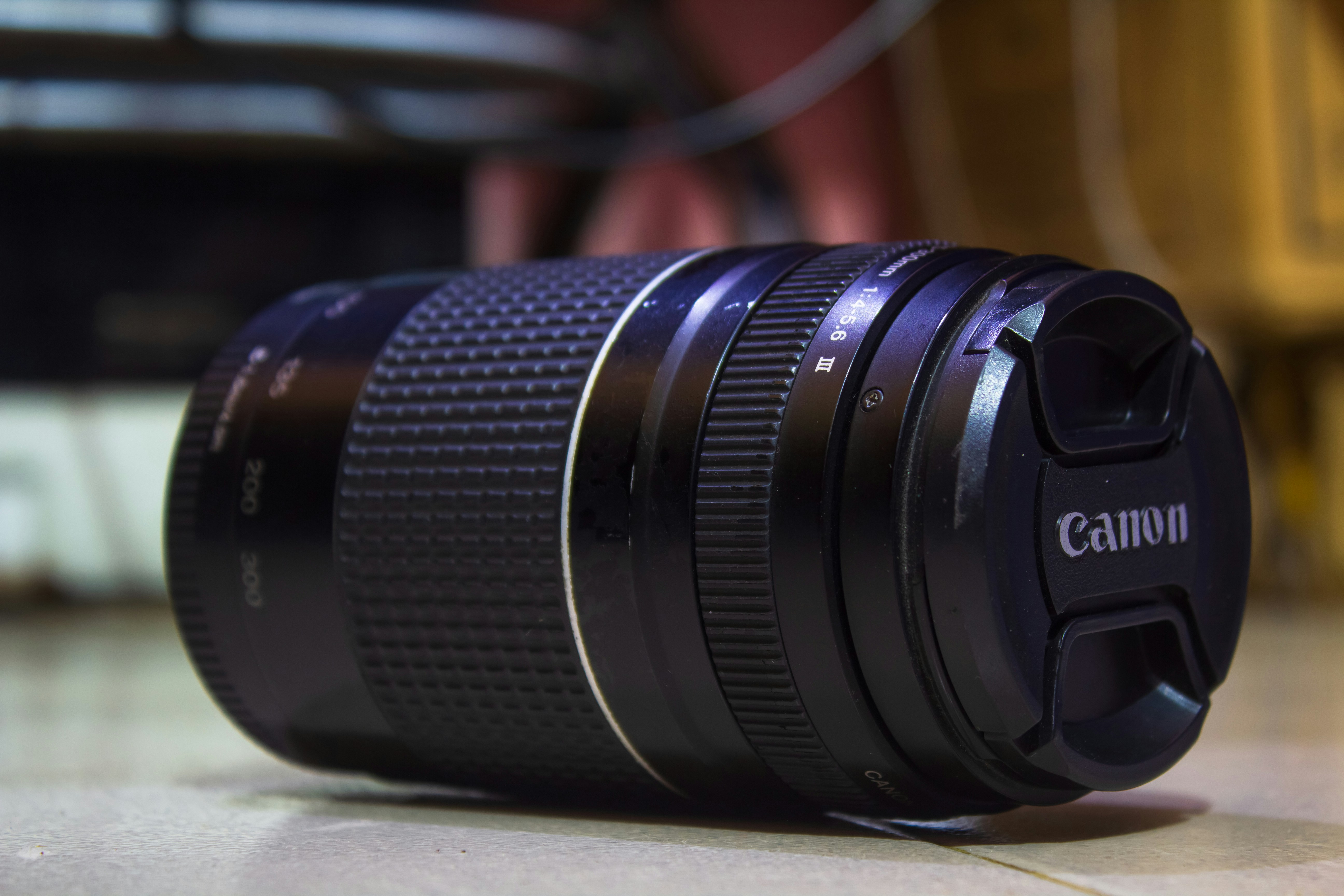 A close up of a camera lens on the ground photo – Free Zoom lens Image ...