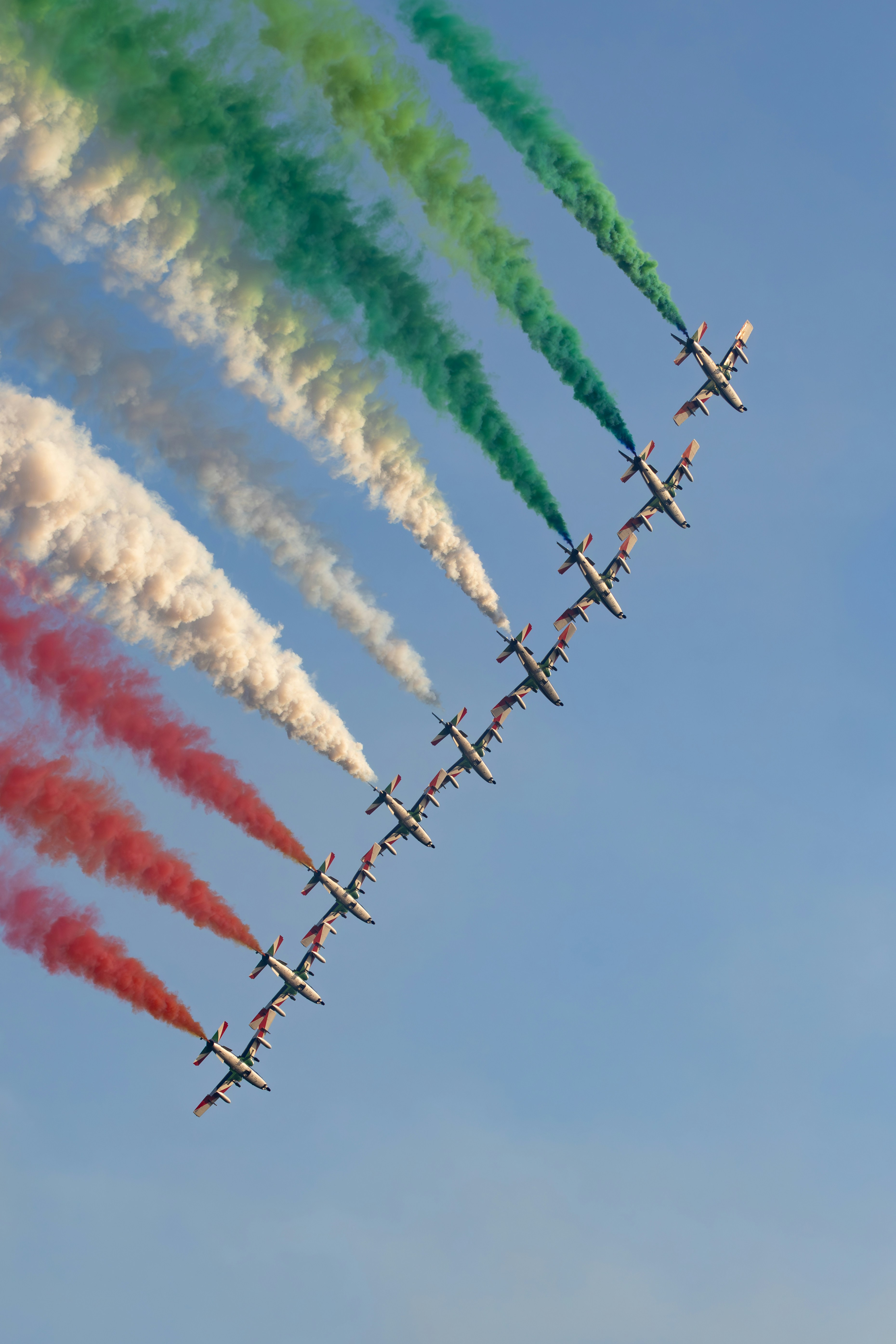 Vibrant Skyward Arrow: An Airshow of Color Trails