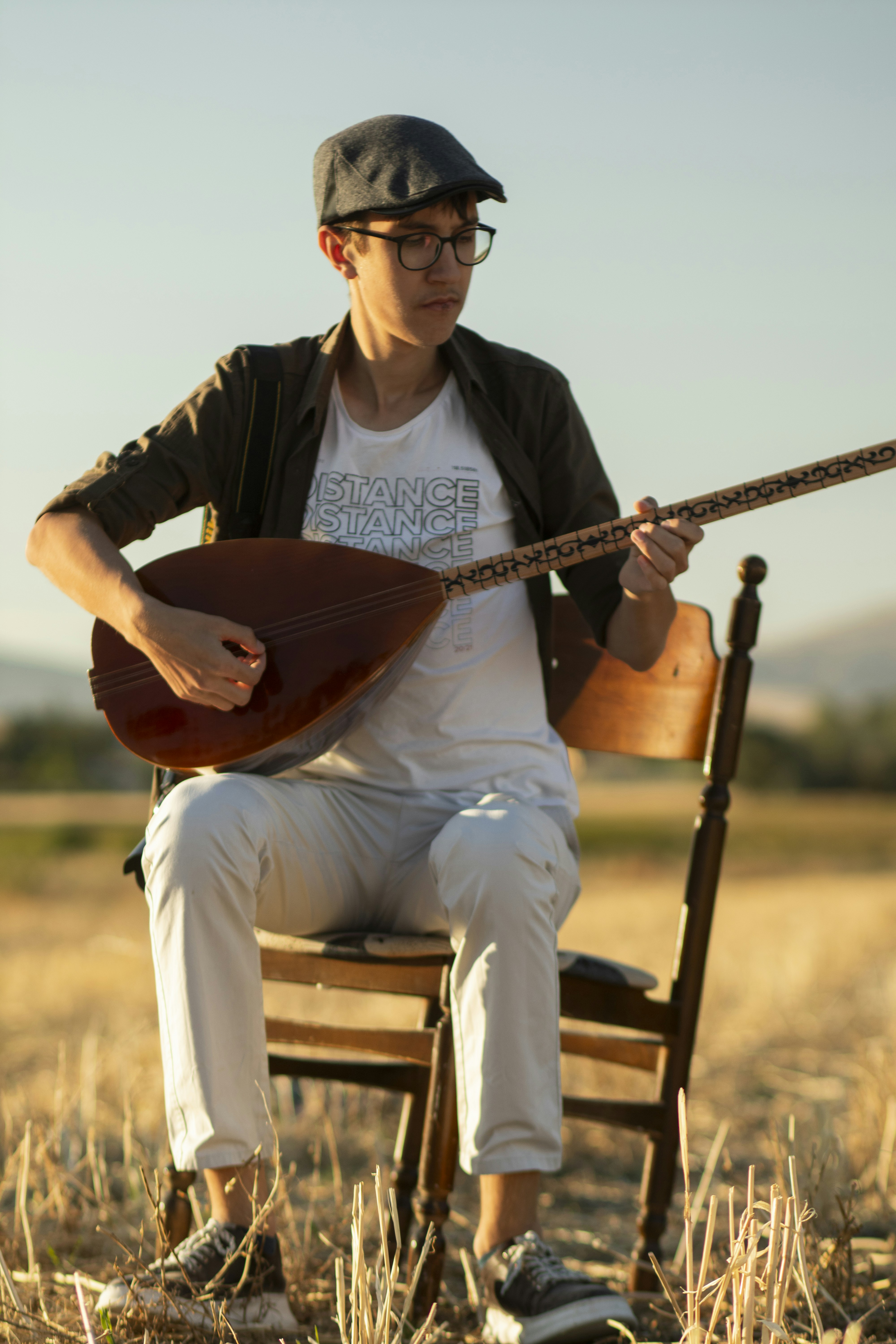 Strings in the Golden Field: A guitarist in quiet daylight