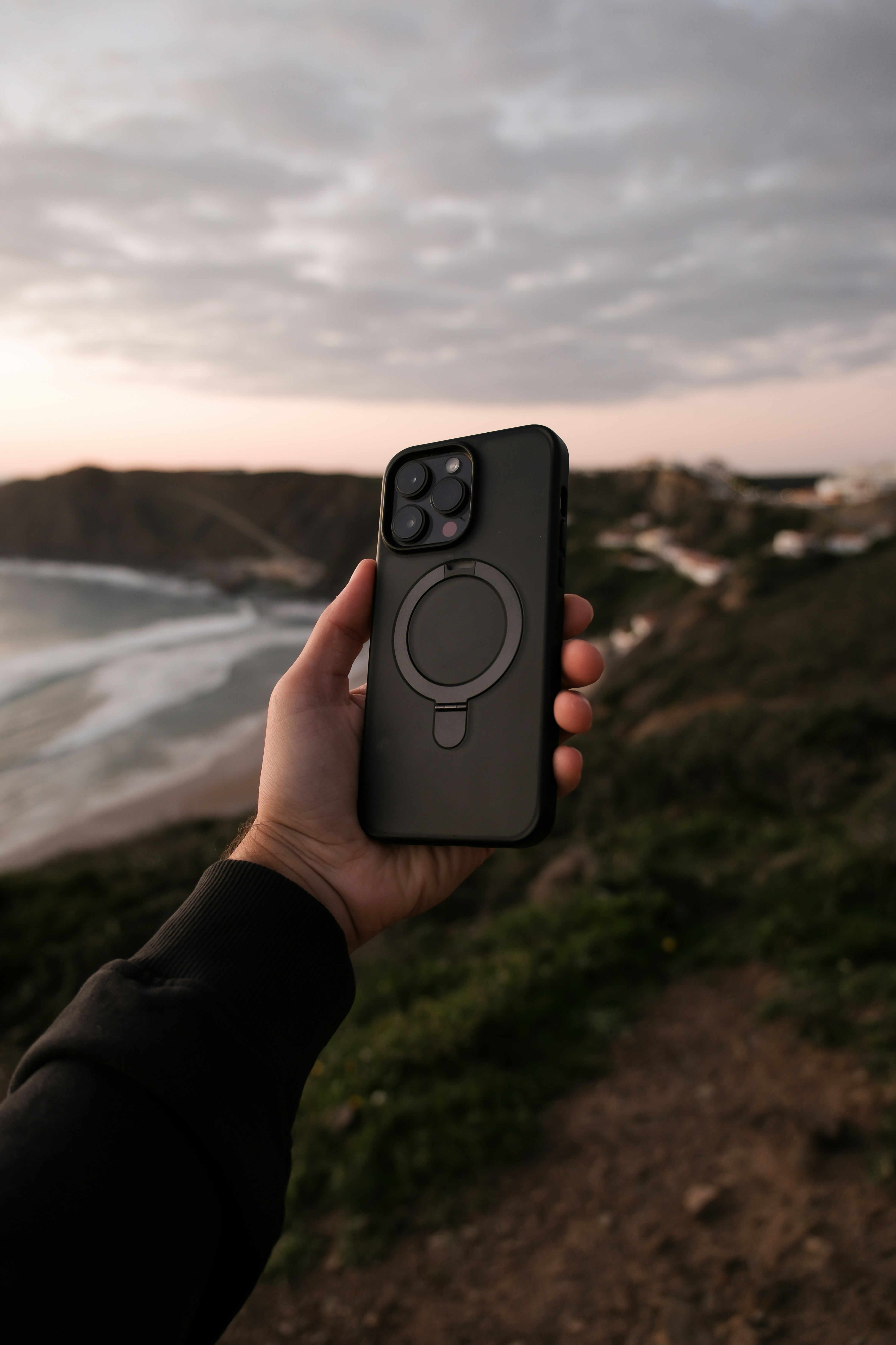 Horizon in Hand: A Sunset-Cliffs Moment Framed by a Phone