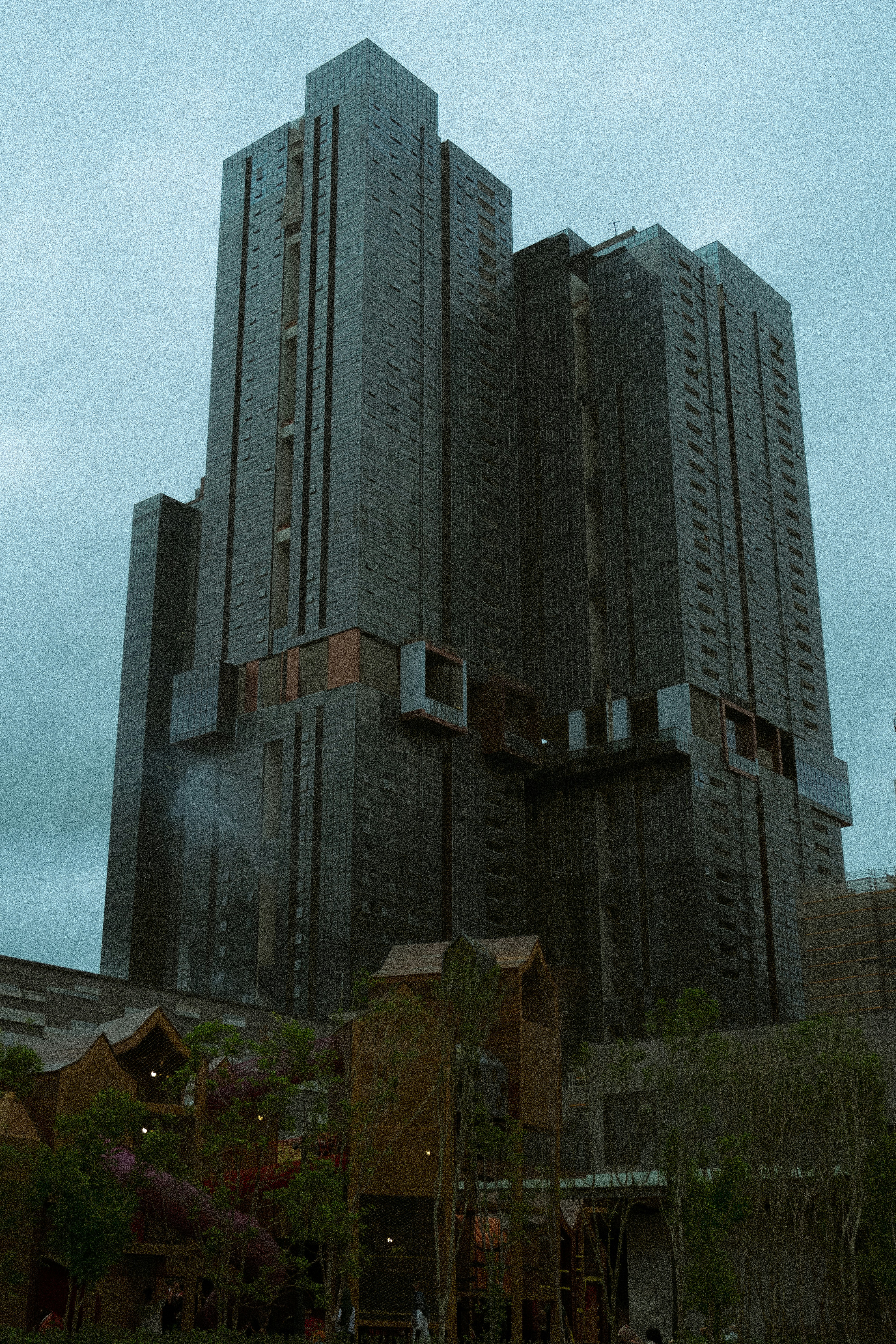 Concrete Monolith Rising Above a Timbered Foreground