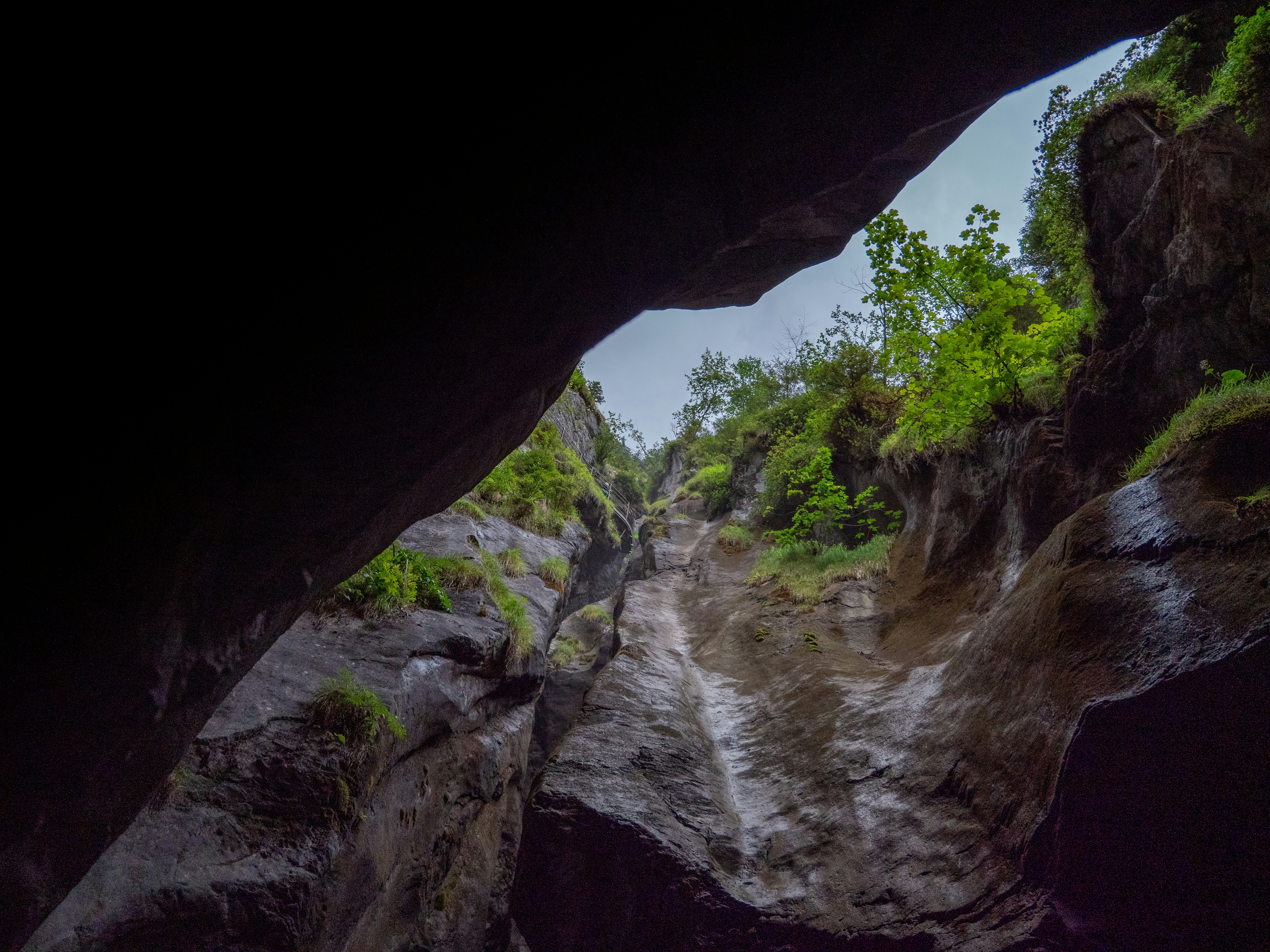 A view of a narrow path through a cave photo – Free Lauterbrunnen Image ...