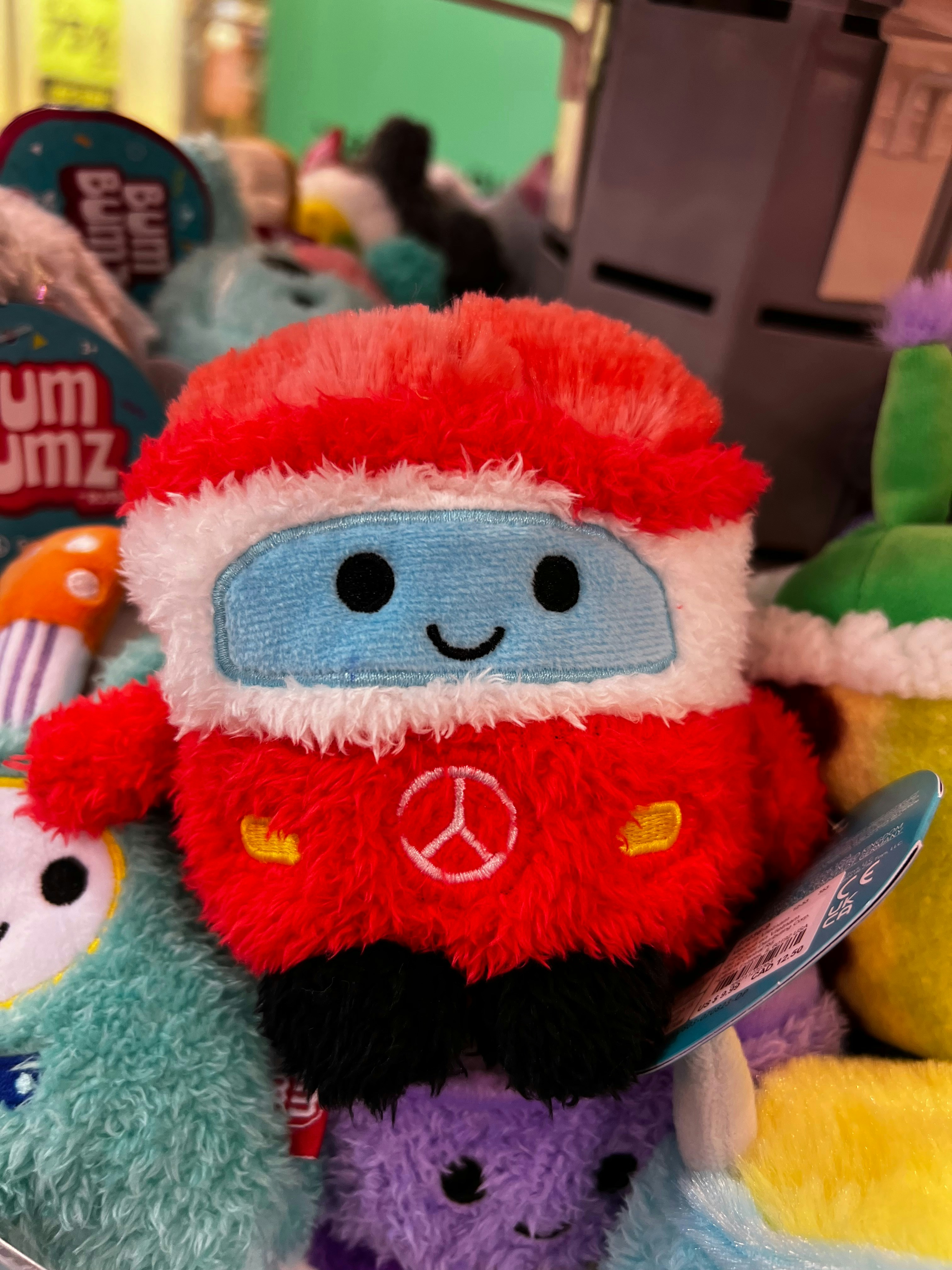 Red-Wheeled Cheer: Plush Toy Car with Friendly Smile