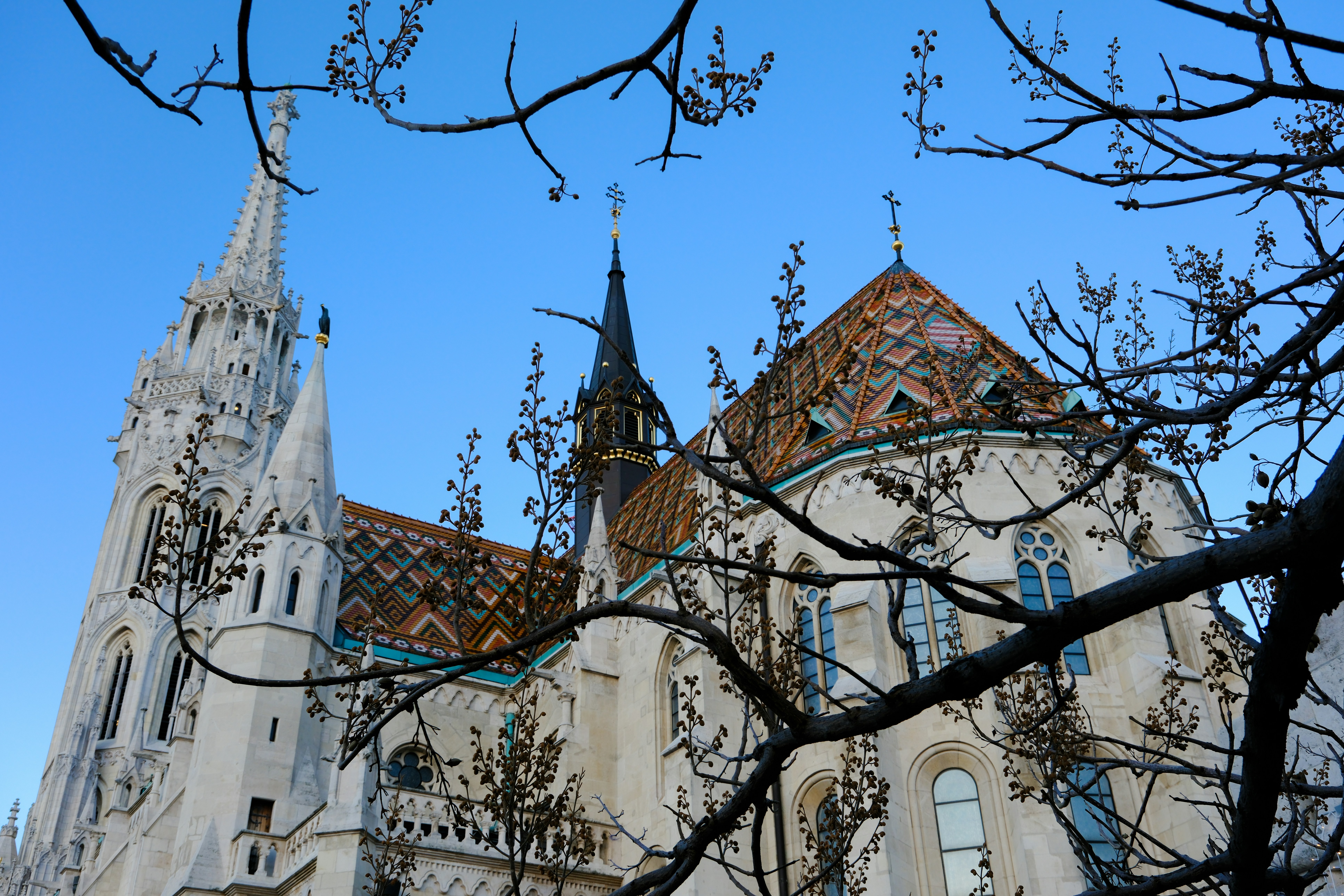 A large building with a steeple and a clock tower photo – Free Budapest ...