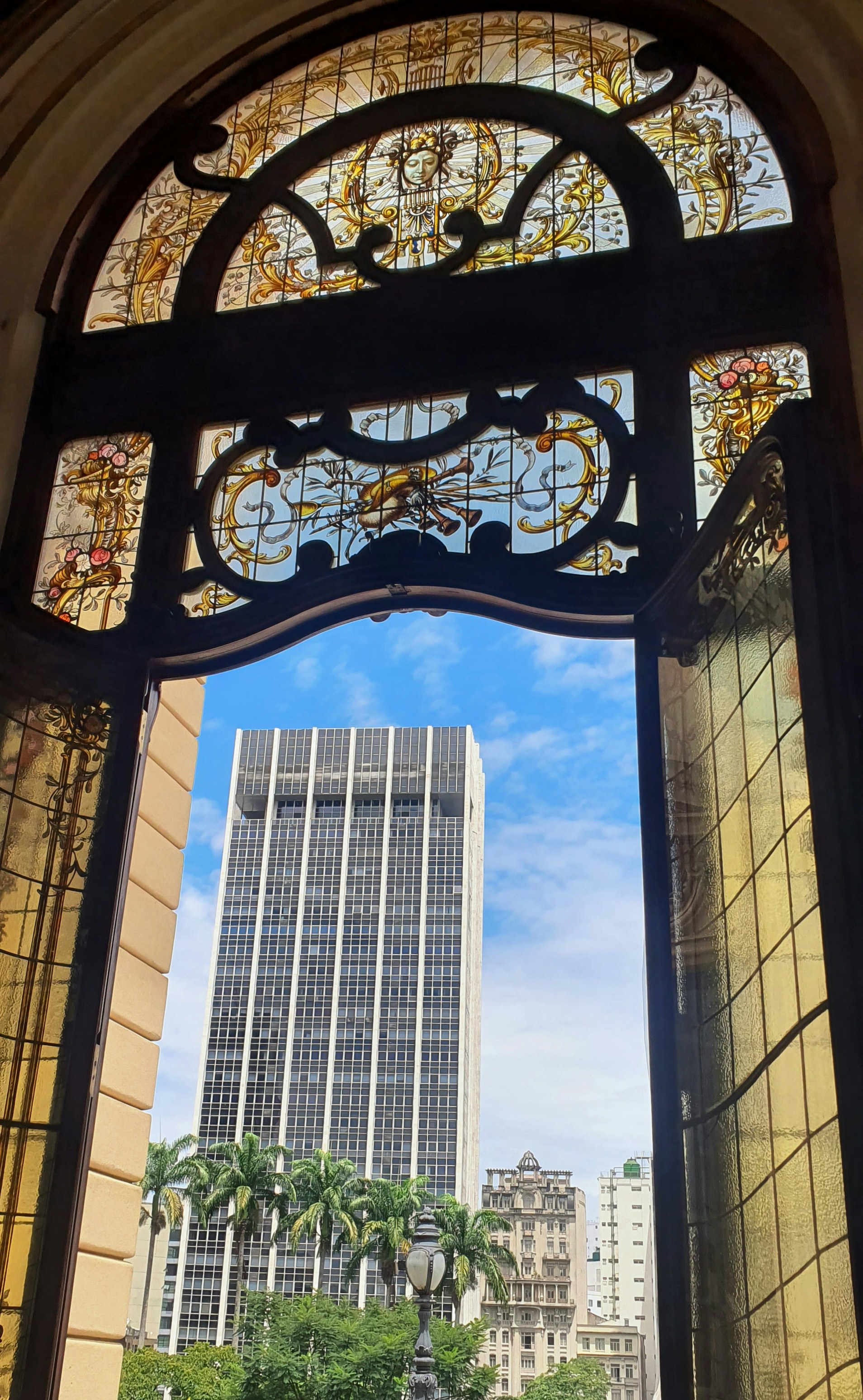 A view of a tall building through a stained glass window photo – Free ...