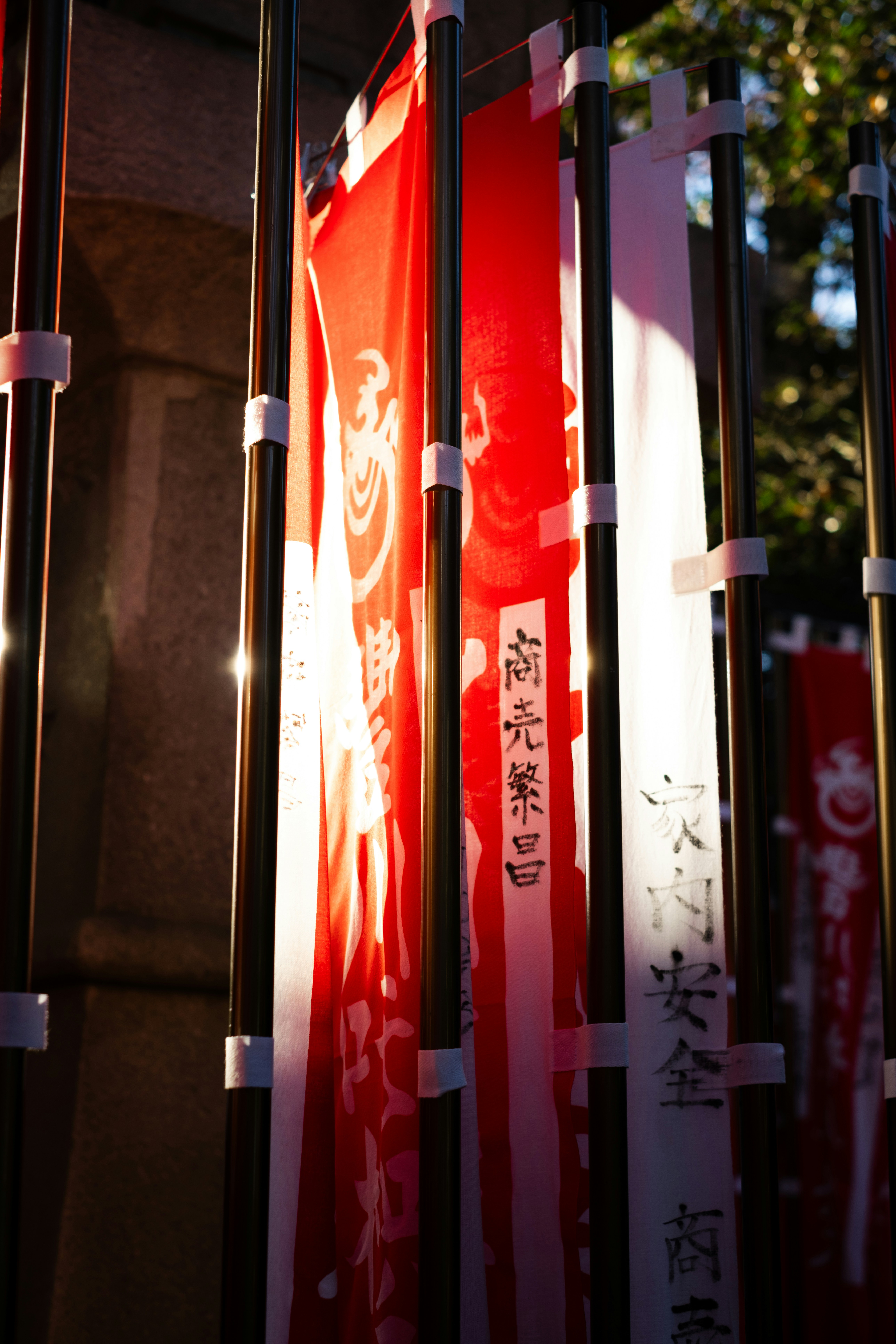 A row of red and white flags with asian writing on them photo – Free ...