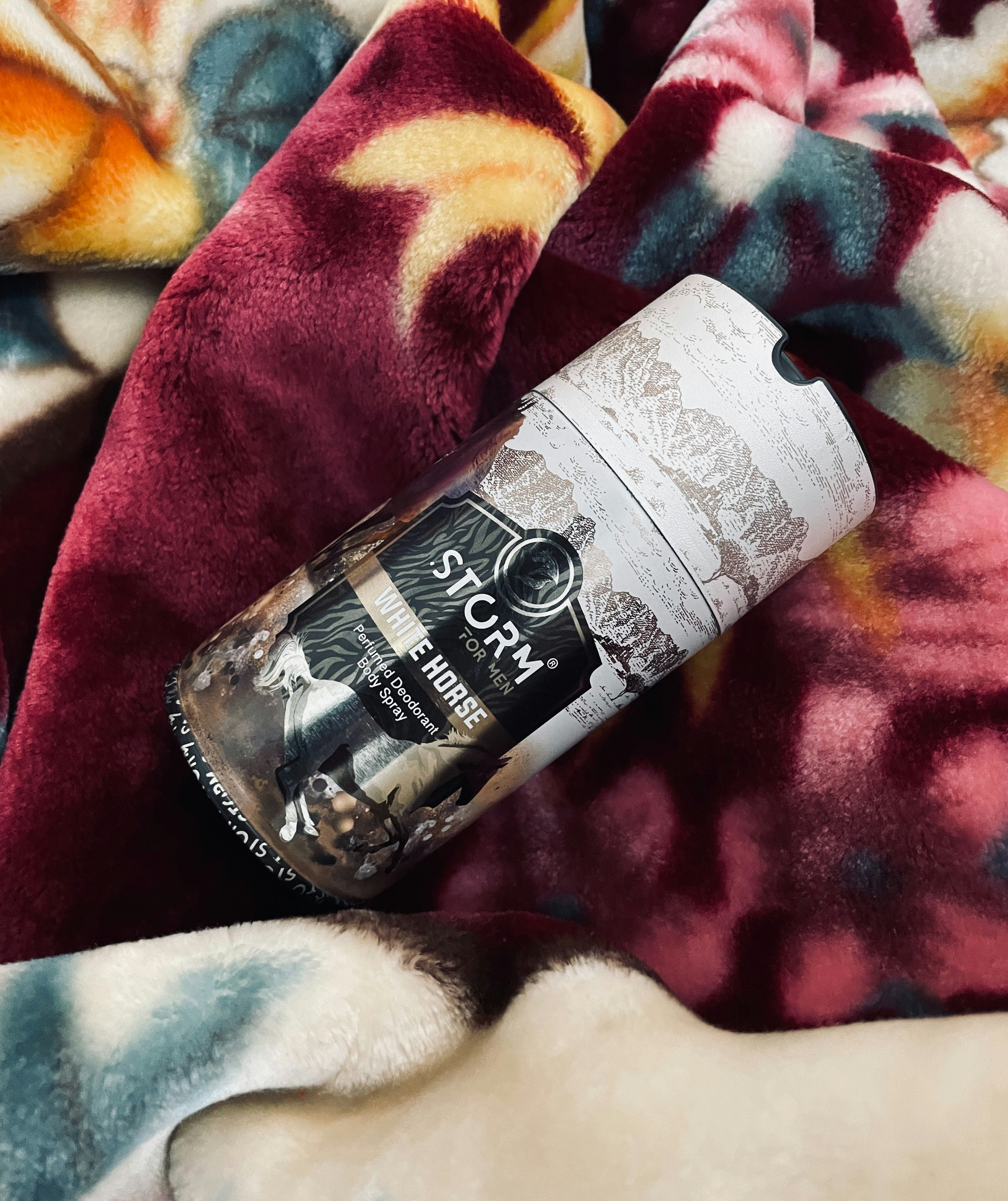 Snow-Lleaved Canister on a Colorful Blanket