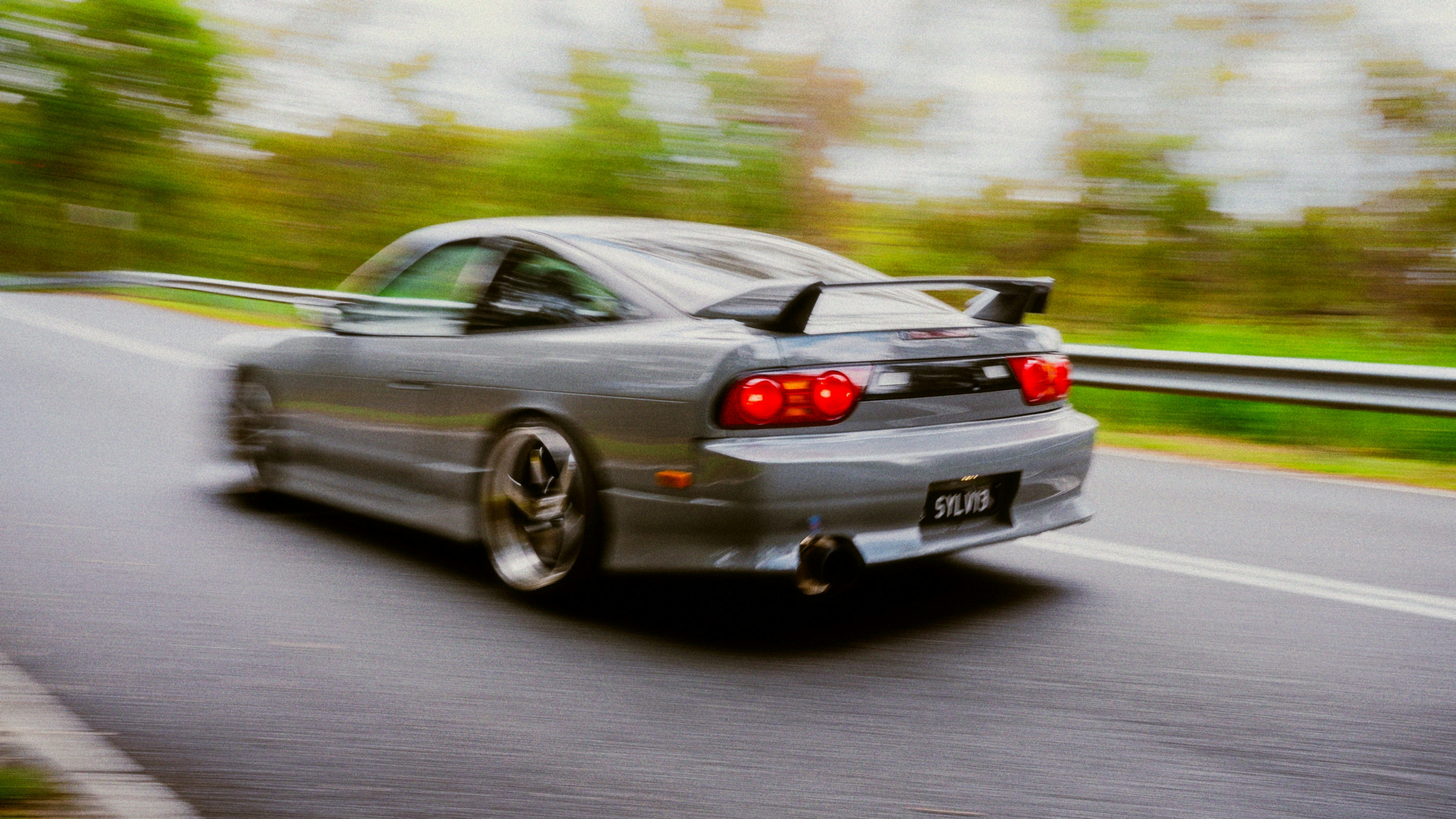 Silver Skyline: A Blurred Burst on the Open Road