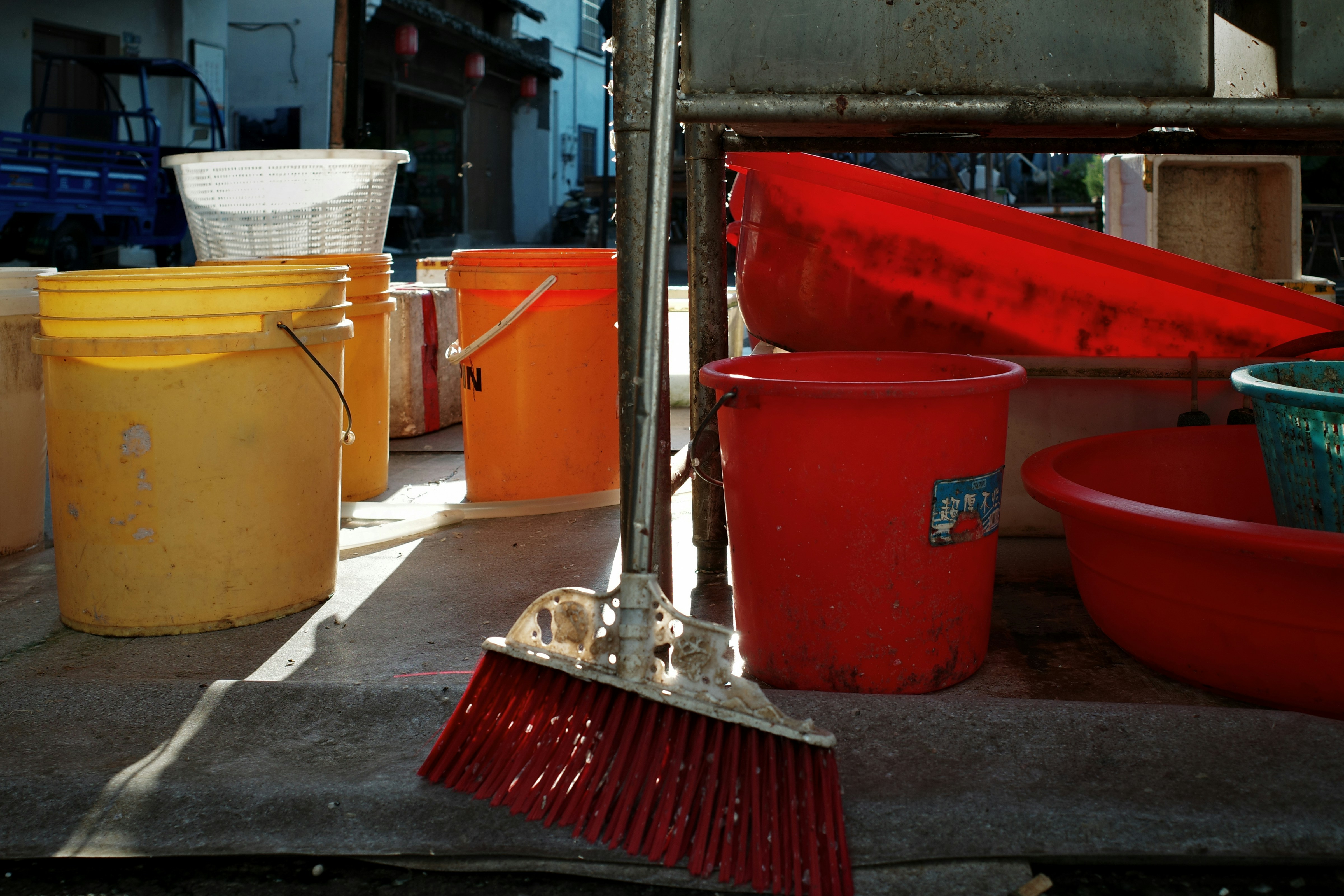 Buckets and a broom sitting on the ground photo – Free Bucket Image on ...