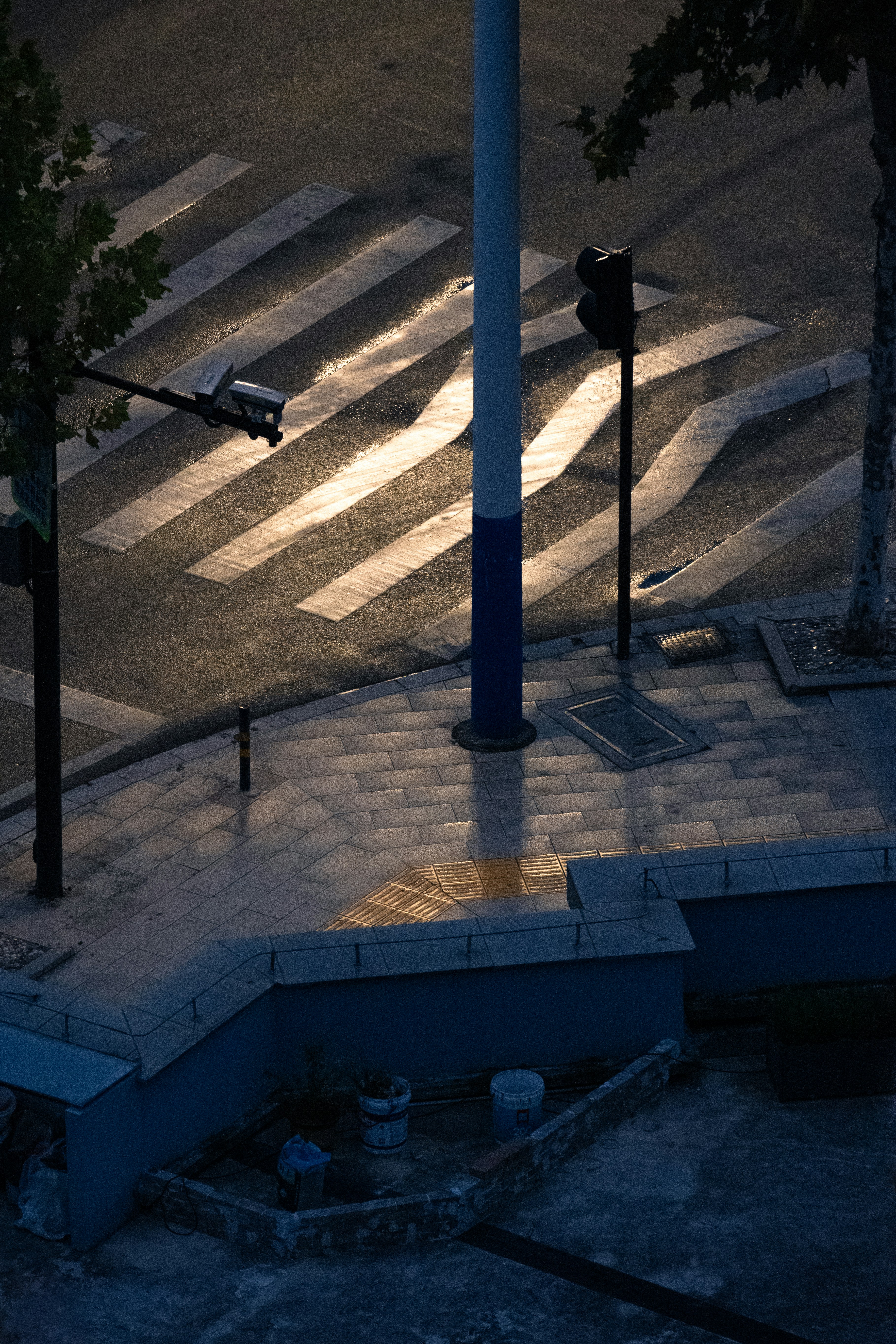 Urban Reflections: A Quiet Intersection After Rain