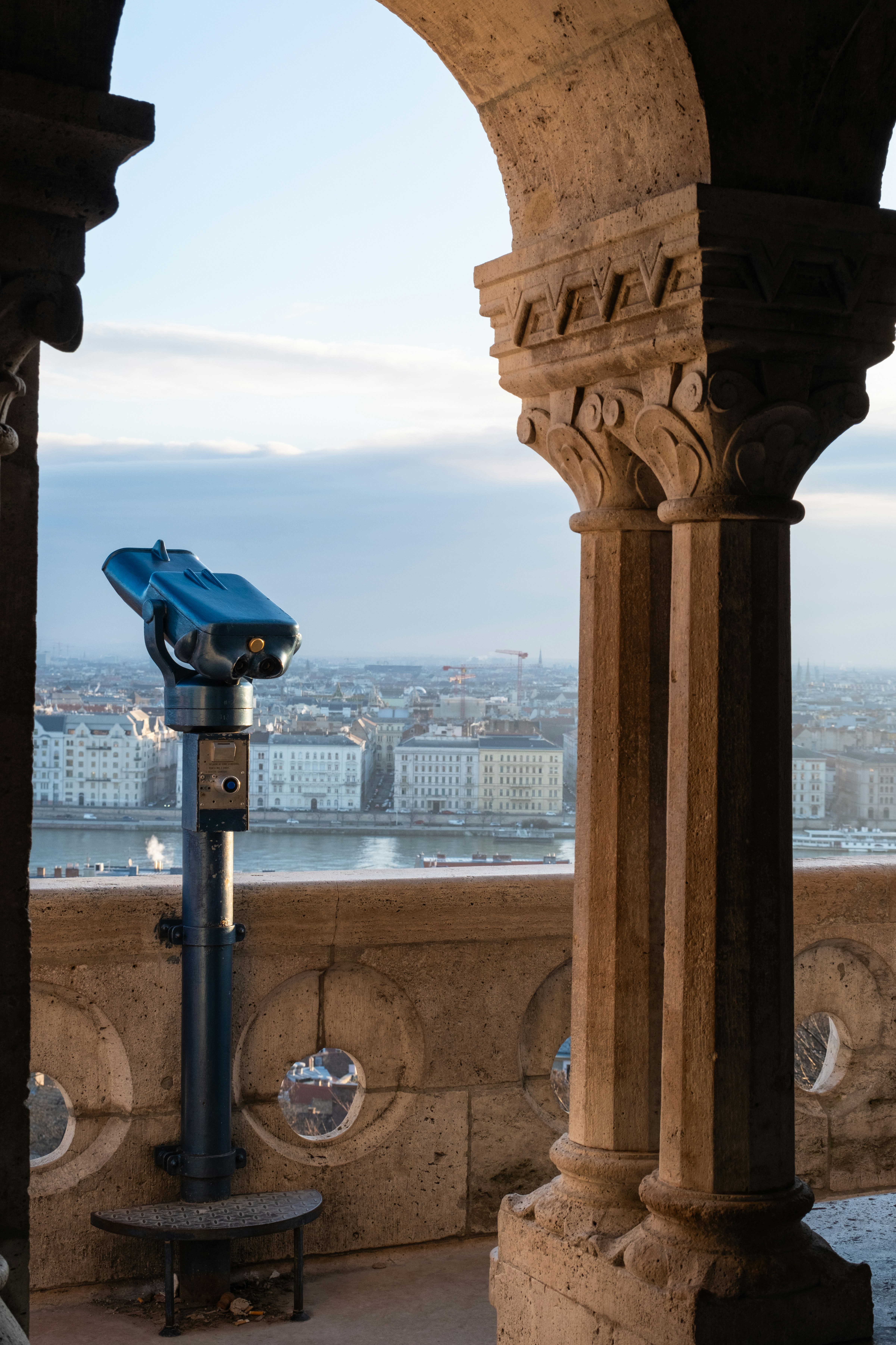 A telescope on top of a building with a view of a city photo – Free ...