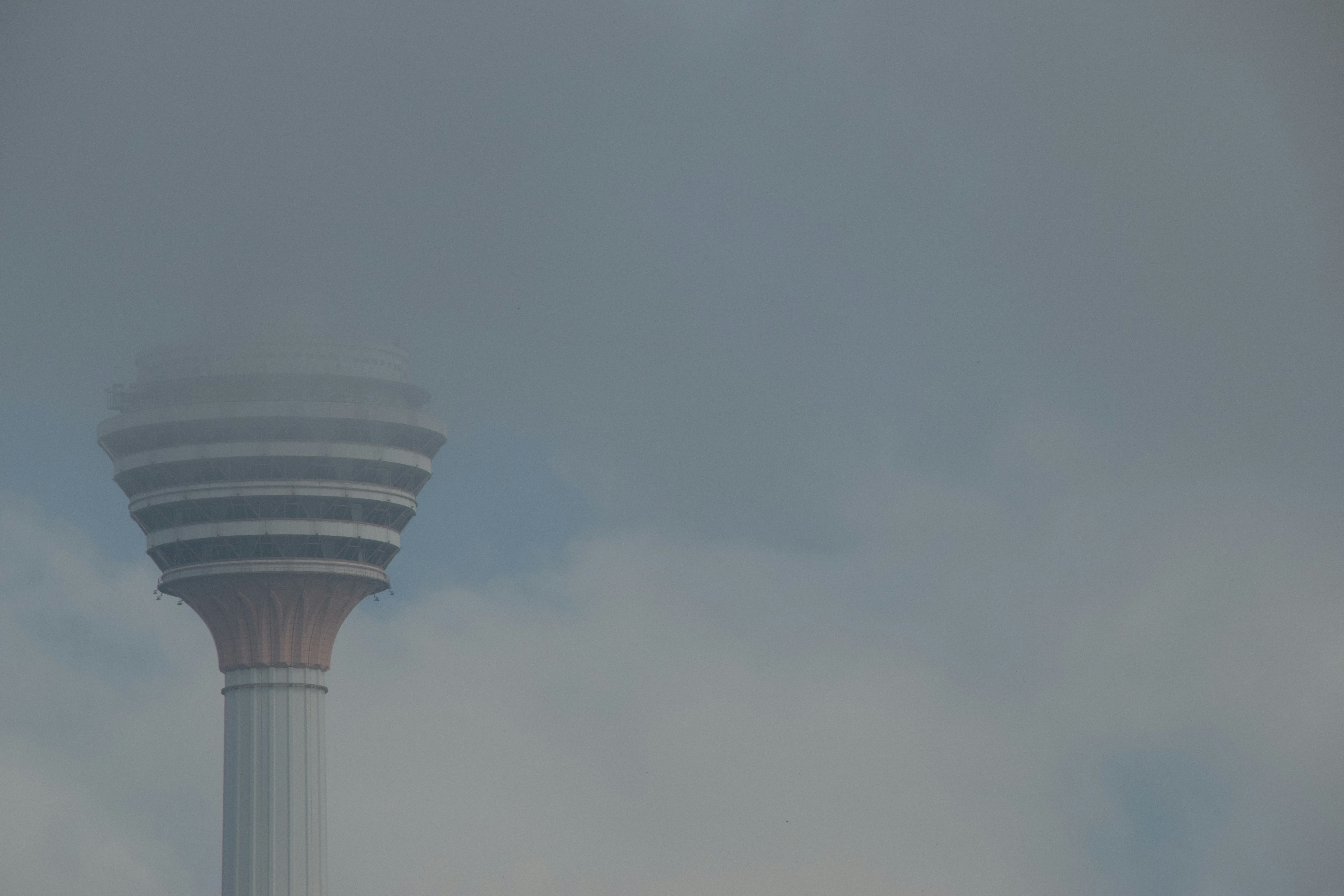 Left-edge Tower Crown Piercing the Mist