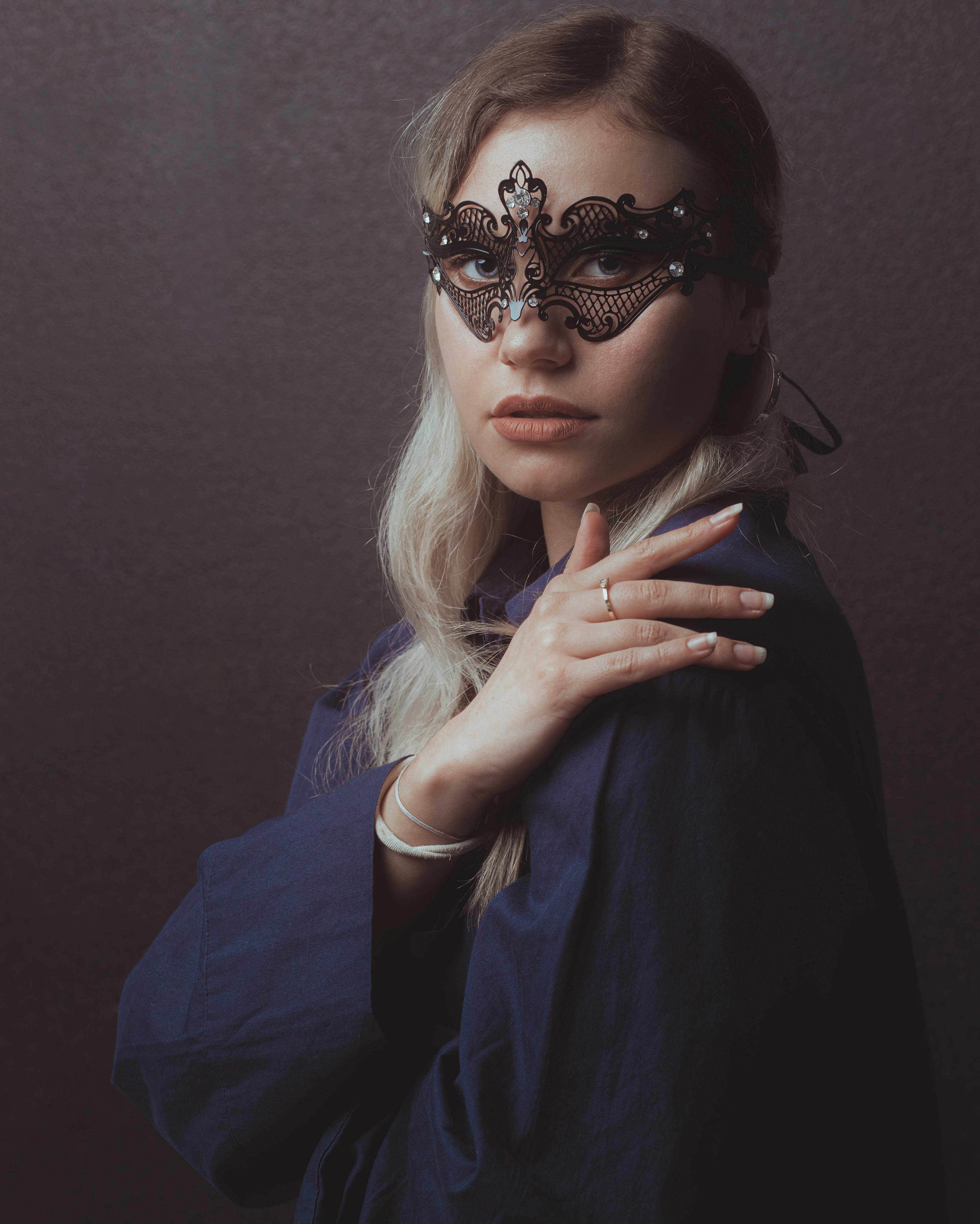 A woman with a mask on her face photo – Free Portrait Image on Unsplash