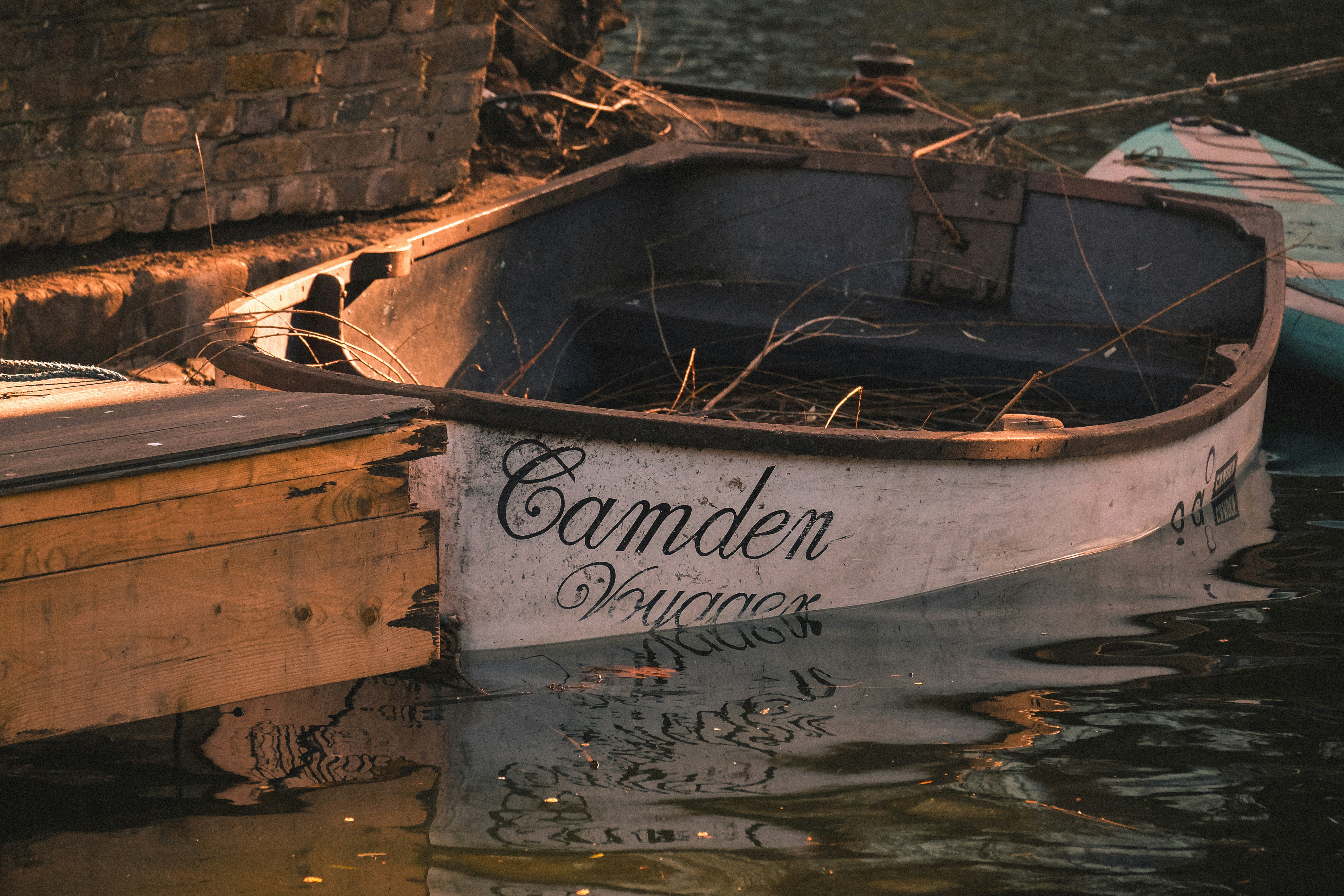 Camden in Quiet Harbor: Weathered Hull and Reflected Light