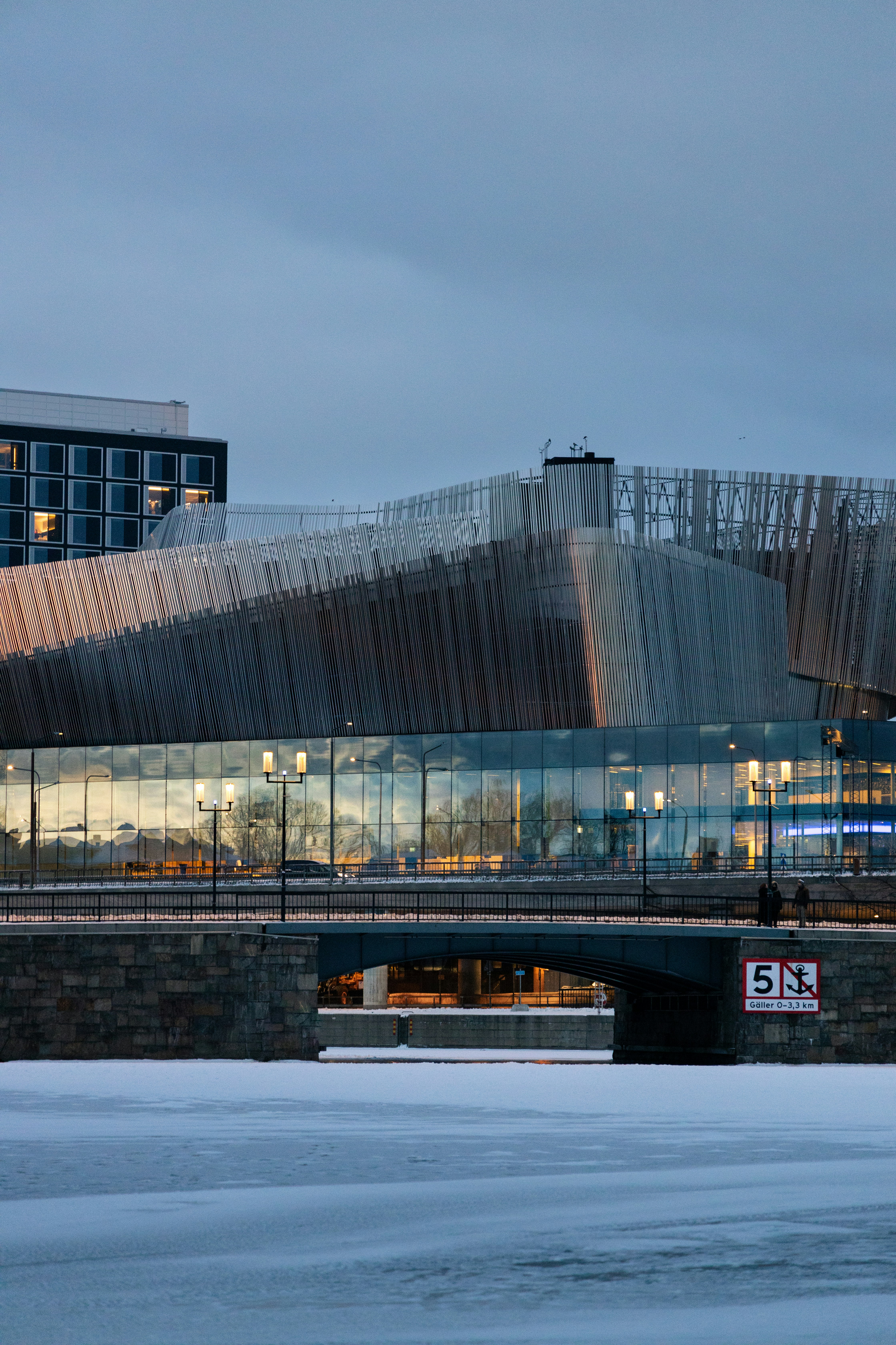 Dusk Over Diagonal Facades: Reflections on Glass and Steel by the Ice
