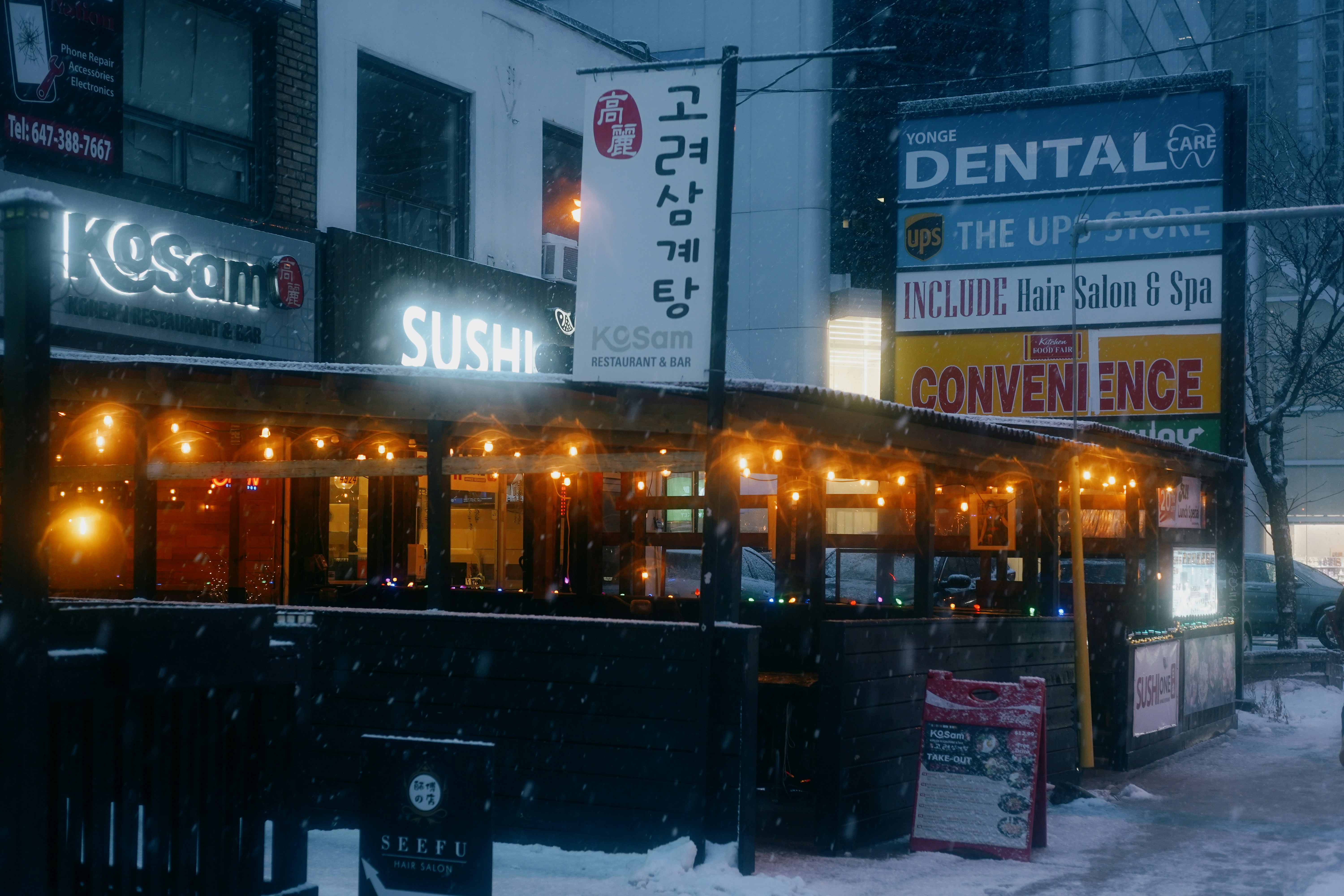 A small restaurant on a snowy street corner photo – Free Canada Image ...