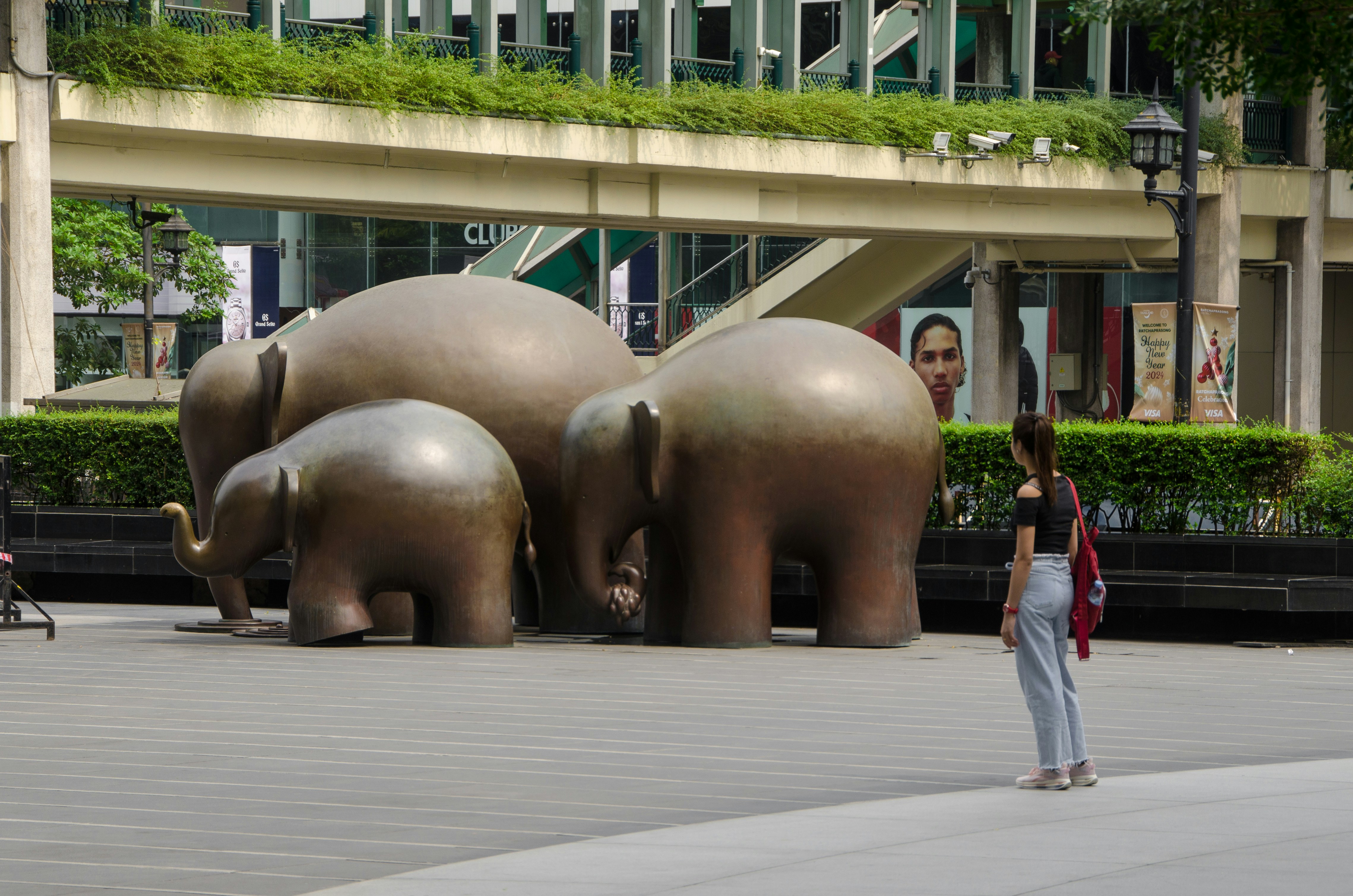 Bronze Elephant Trio Stands Guard Over a Modern City Plaza