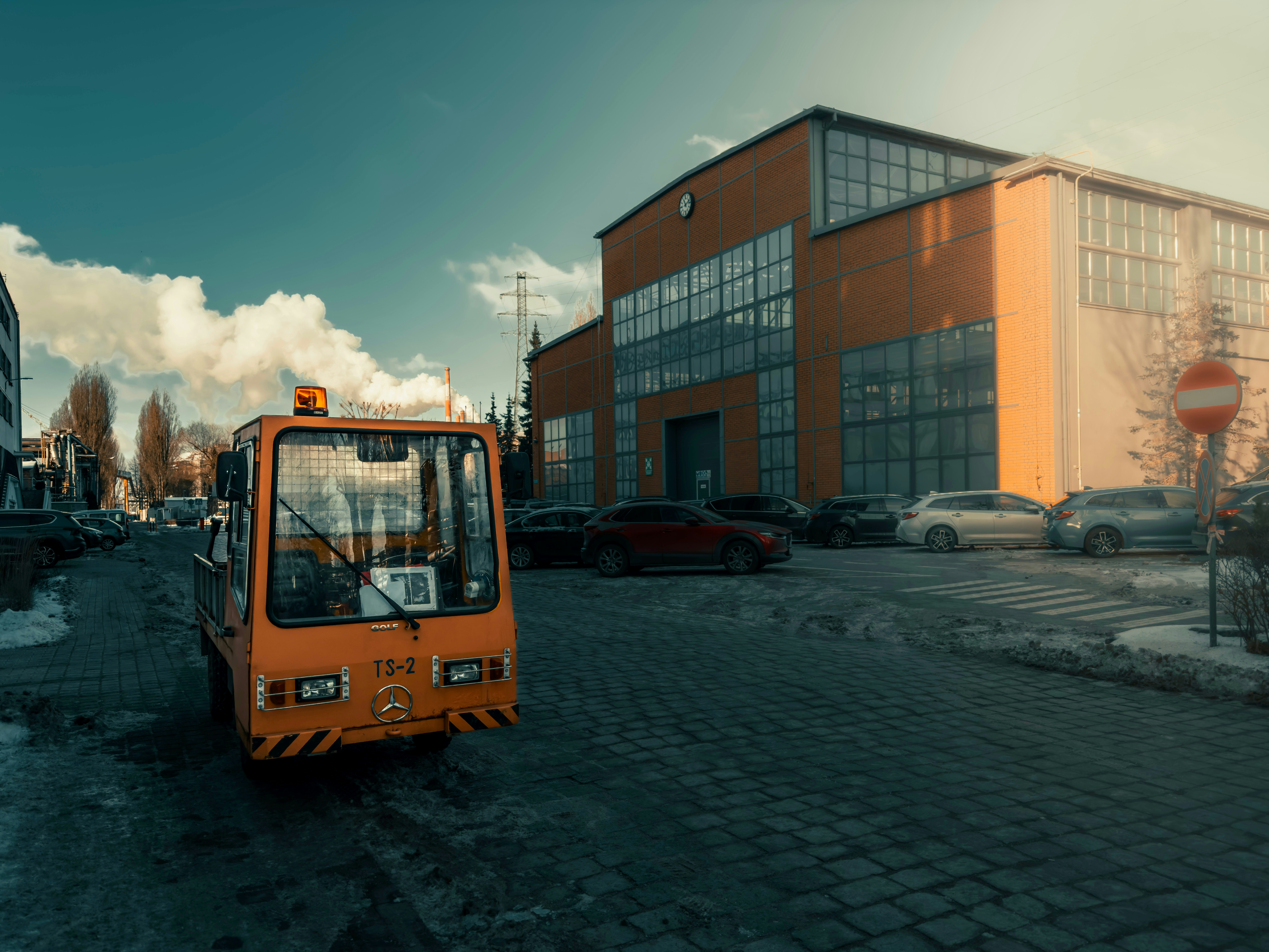 Amber Tram at the Teal-Glazed Industrial Corridor