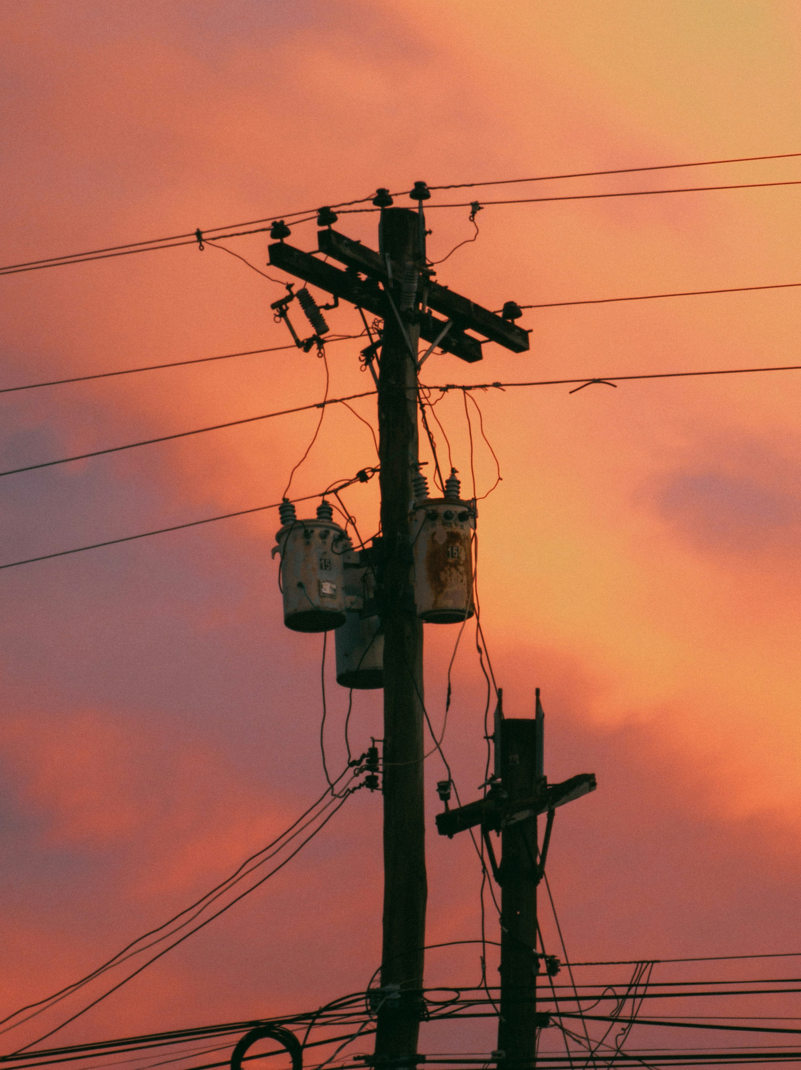 A telephone pole with a lot of wires attached to it photo – Free ...
