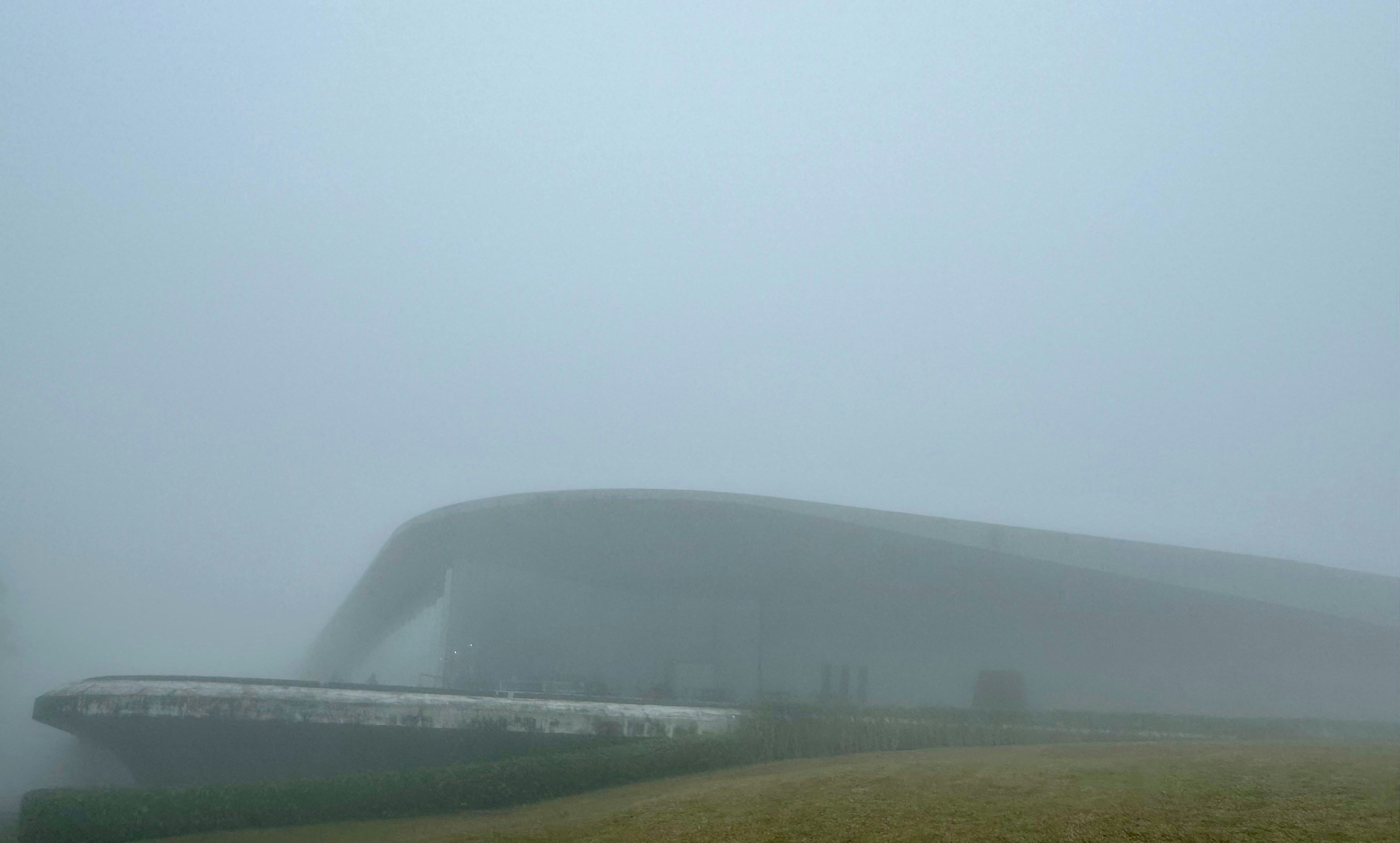 Dome in the Mist: a Curved Shelter Looms Through Fog