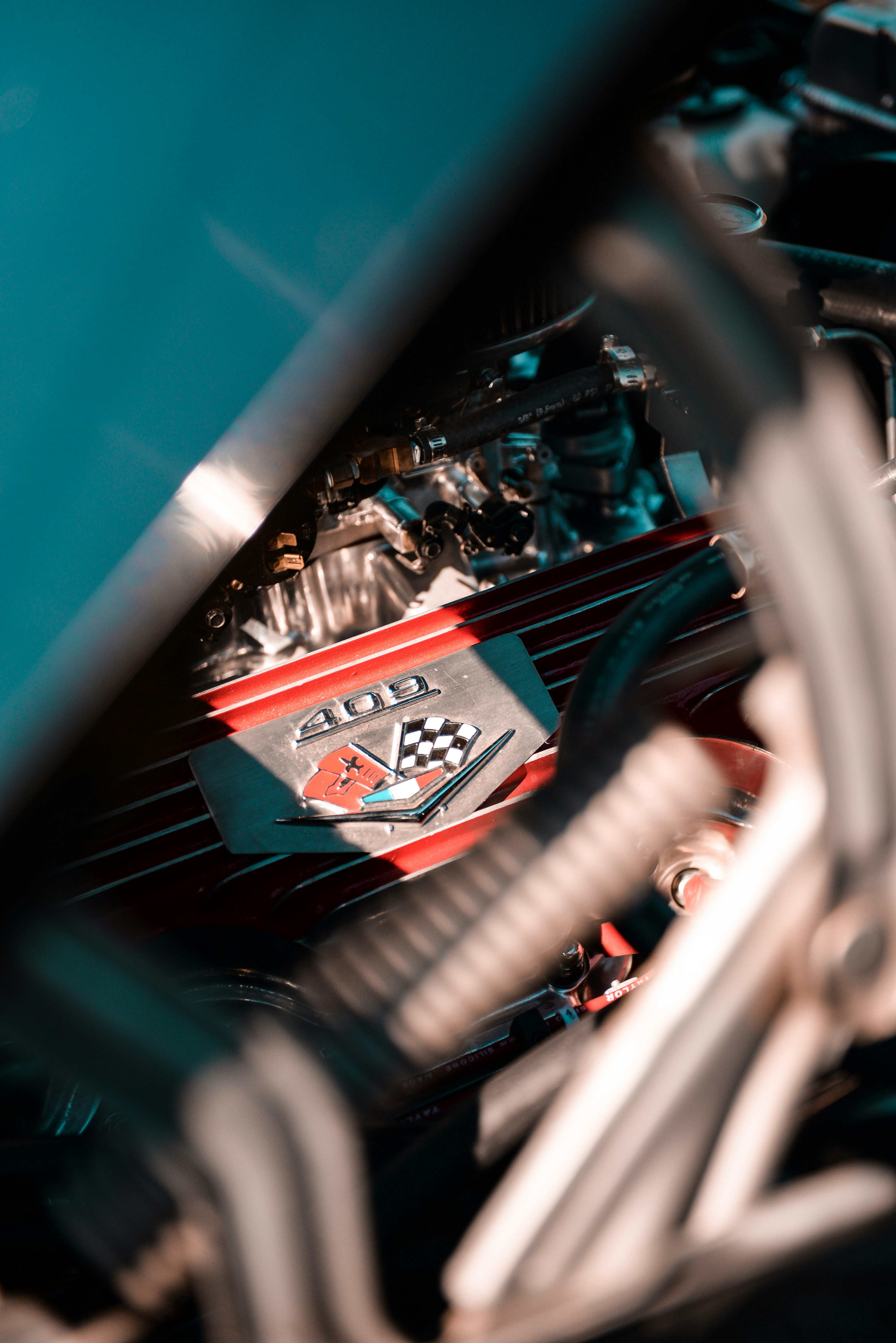 Turquoise Engine Heart: Close-Up on the 400 Badge and Checkered Flag Emblem