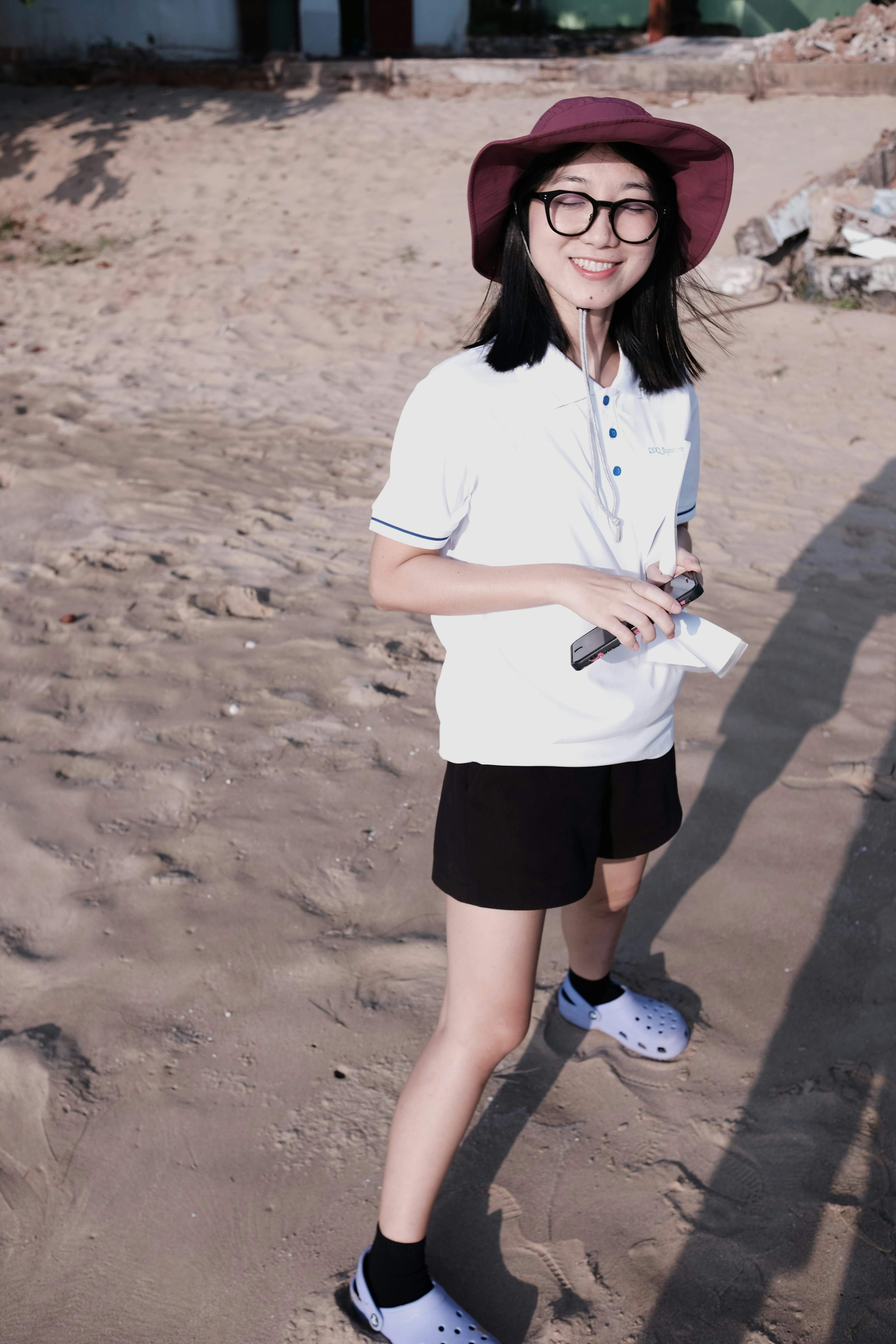 Sunlit Smile on Sandy Shores: A Casual Beach Portrait