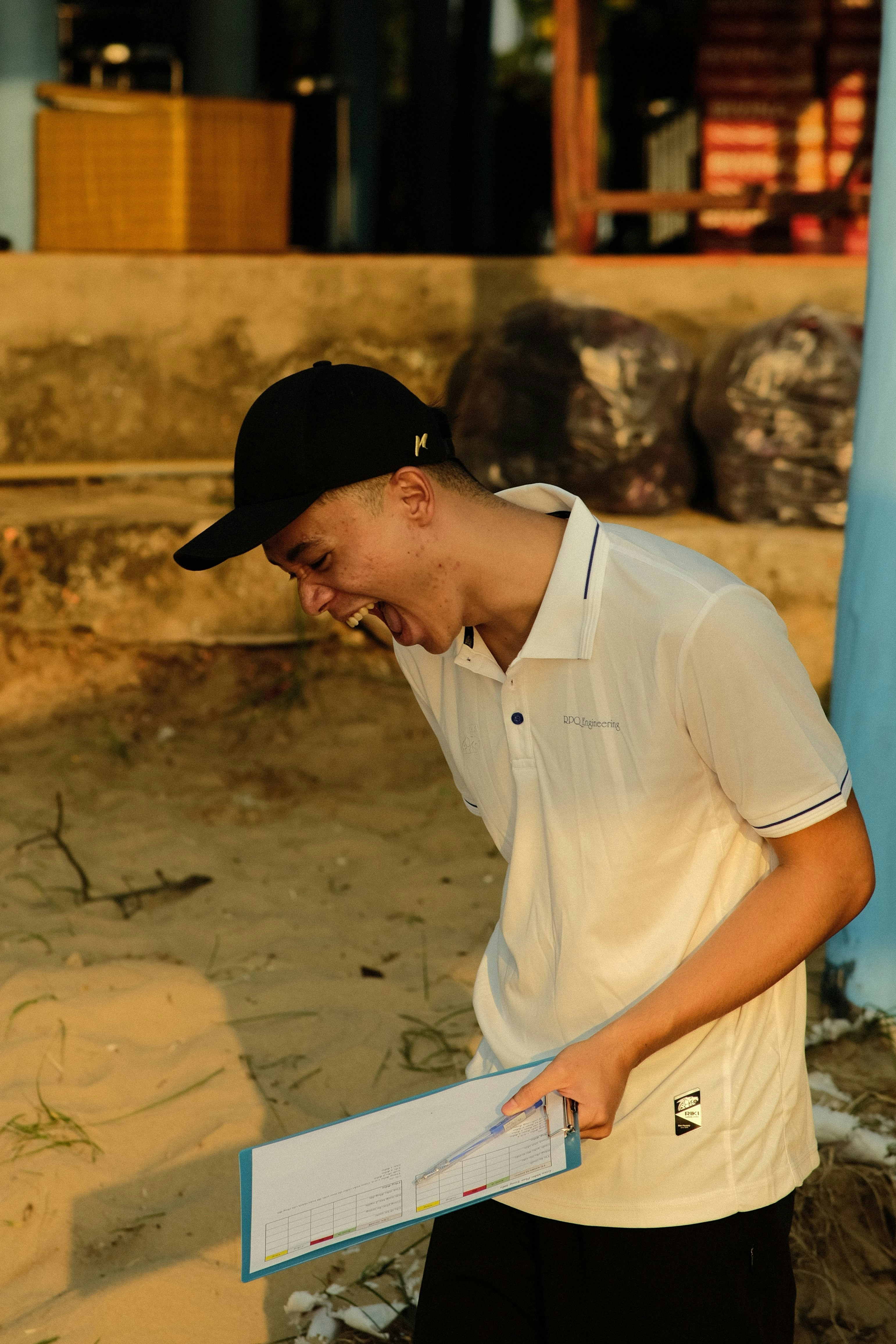 Sunlit Laughs by the Sand: Clipboard Moment