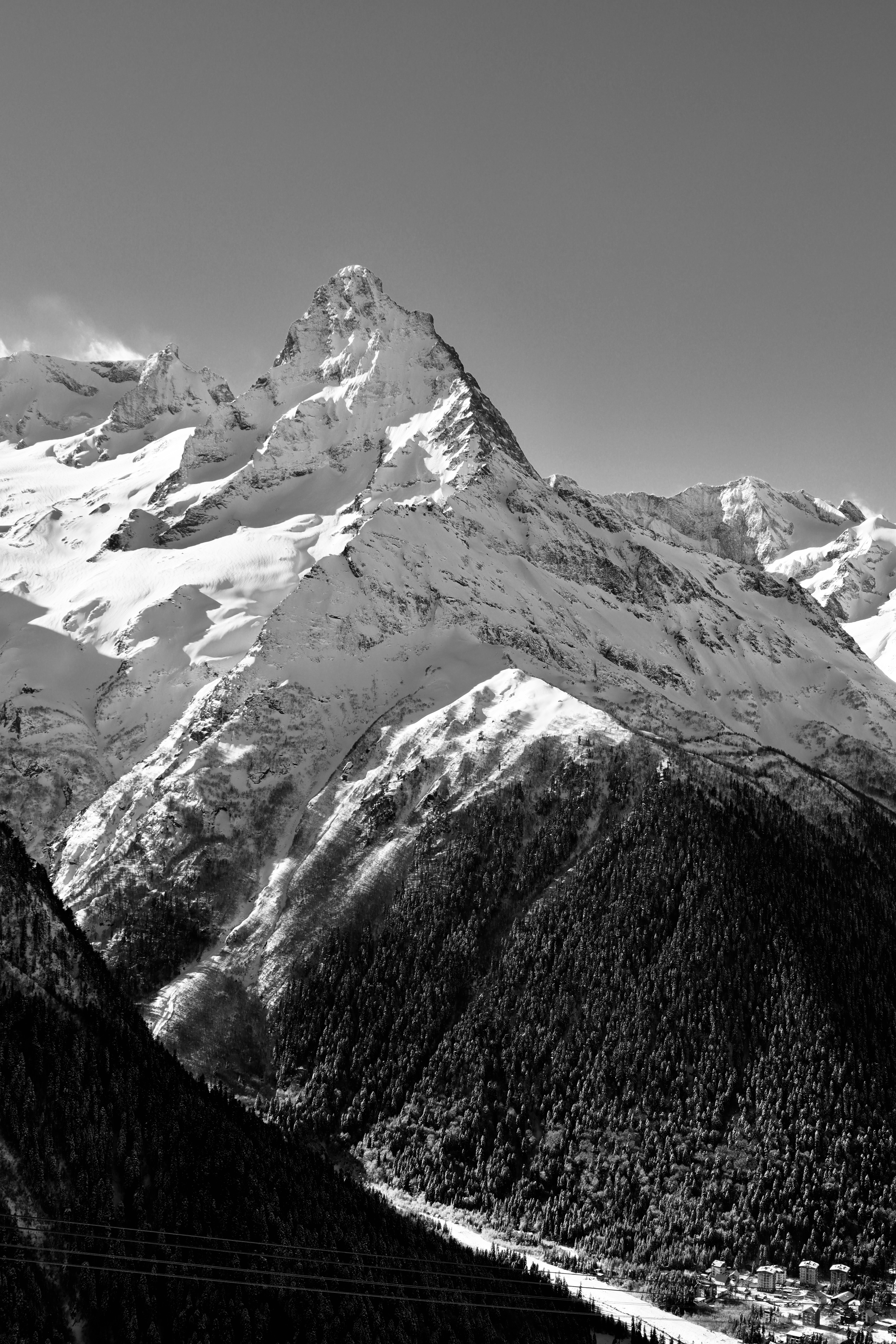 Snow Crowned Summit Over a Quiet Alpine Valley