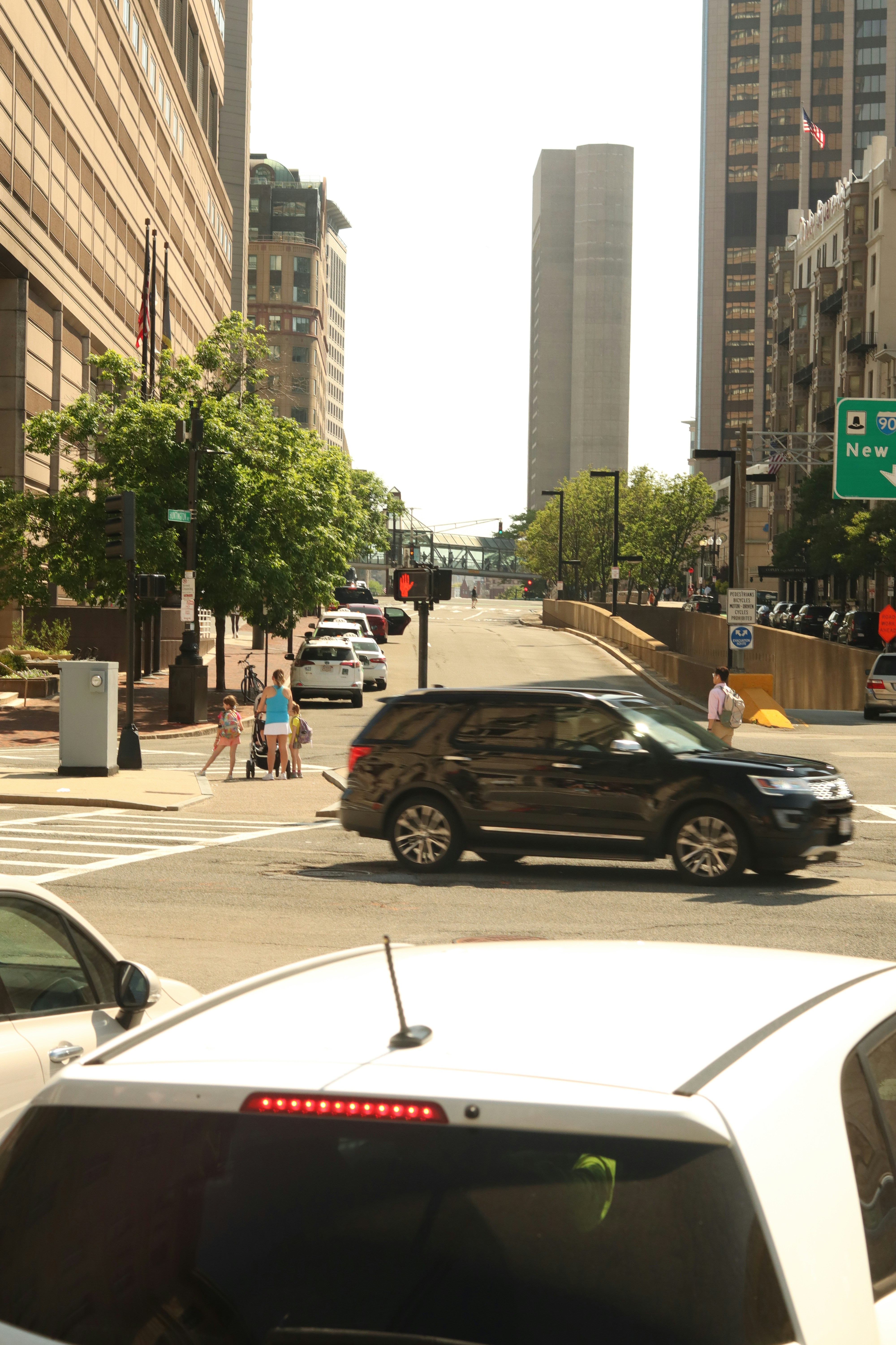 Sunlit Convergence at a Bustling Downtown Crosswalk