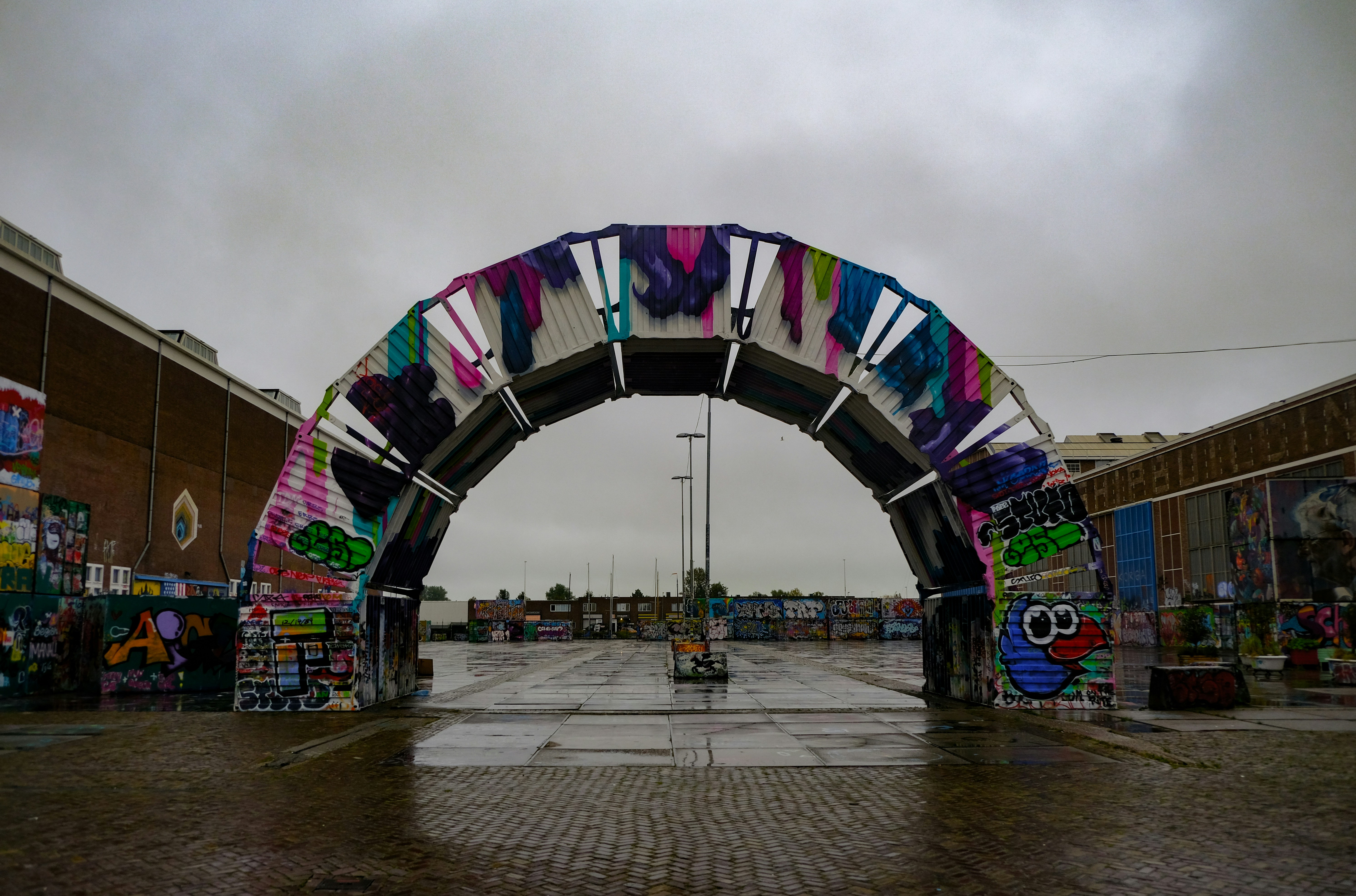 A large open area with a colorful archway photo – Free City Image on ...
