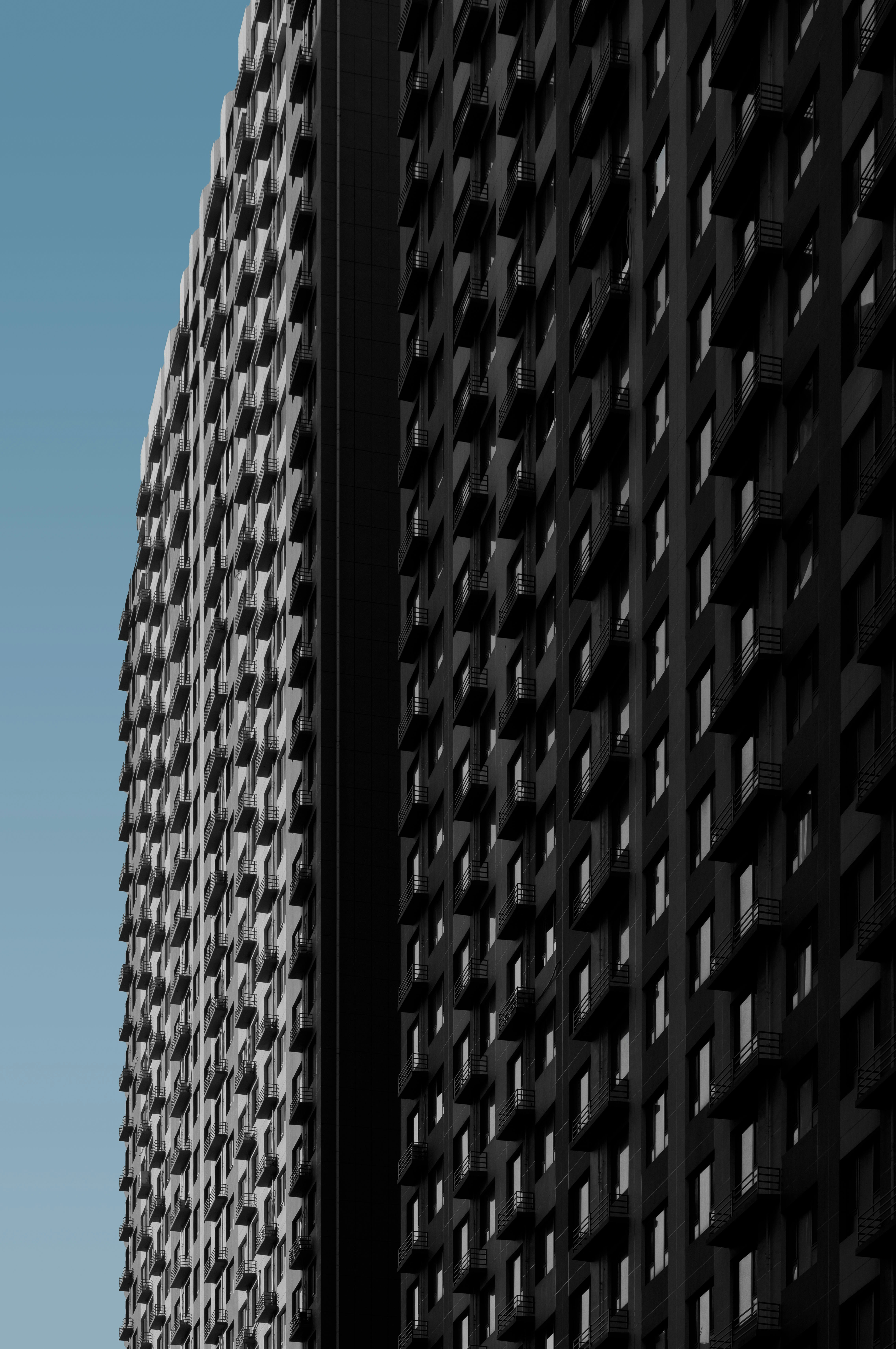 A tall black building with lots of windows photo – Free Urban Image on ...