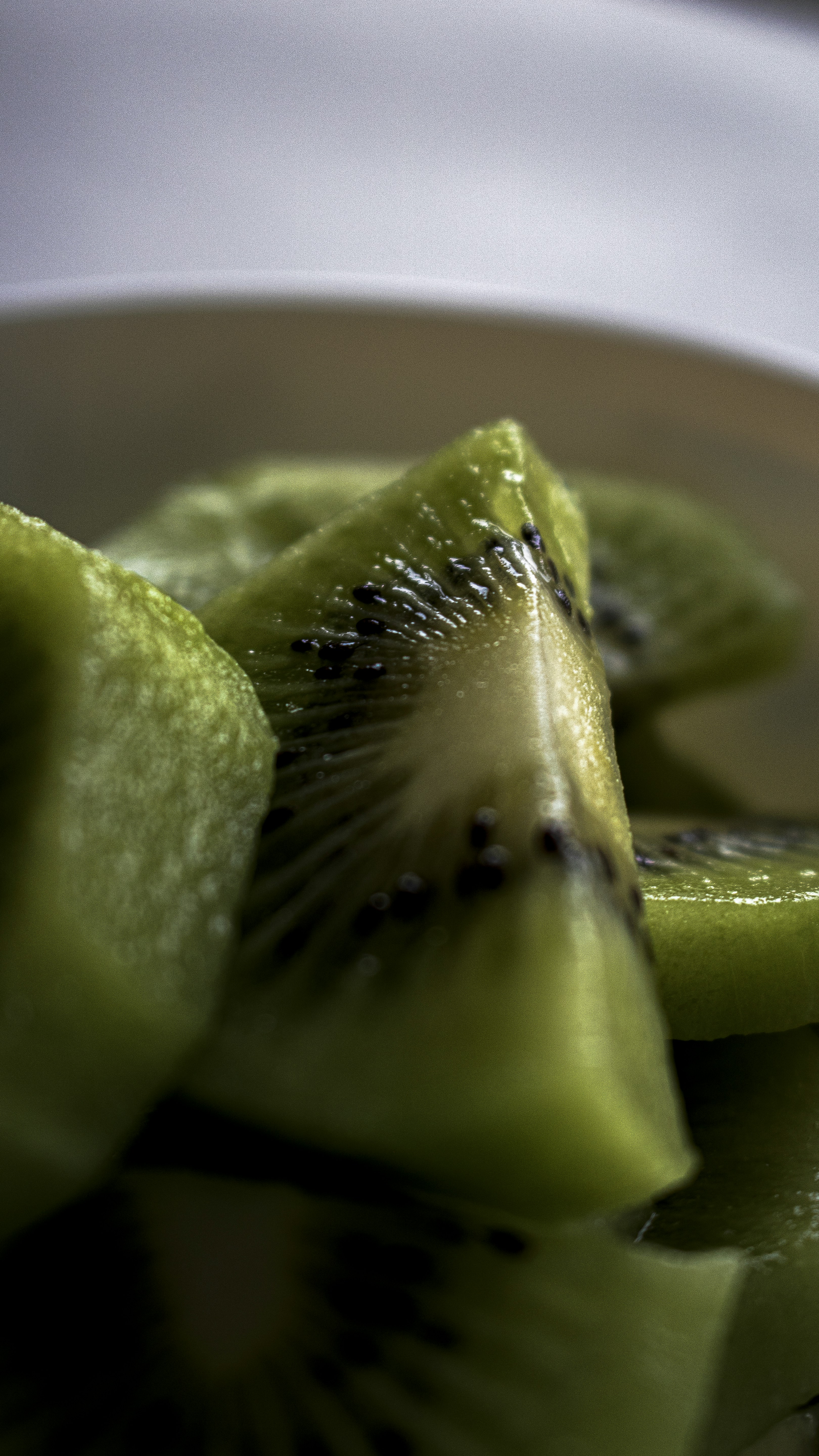 Juicy Angles: Close-Up of Kiwi Slices in Soft Light