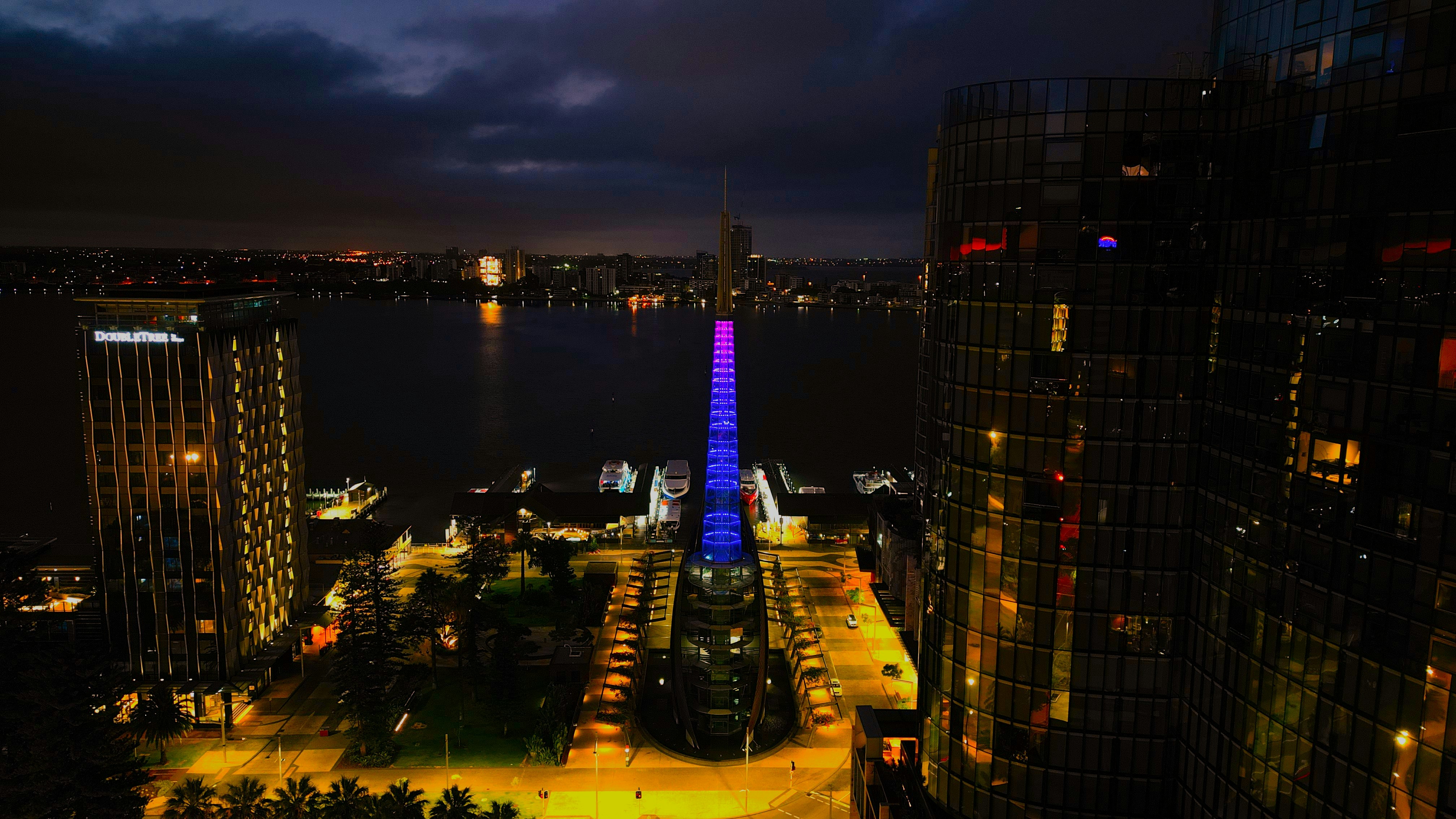 Neon Spire Over the Waterfront Axis
