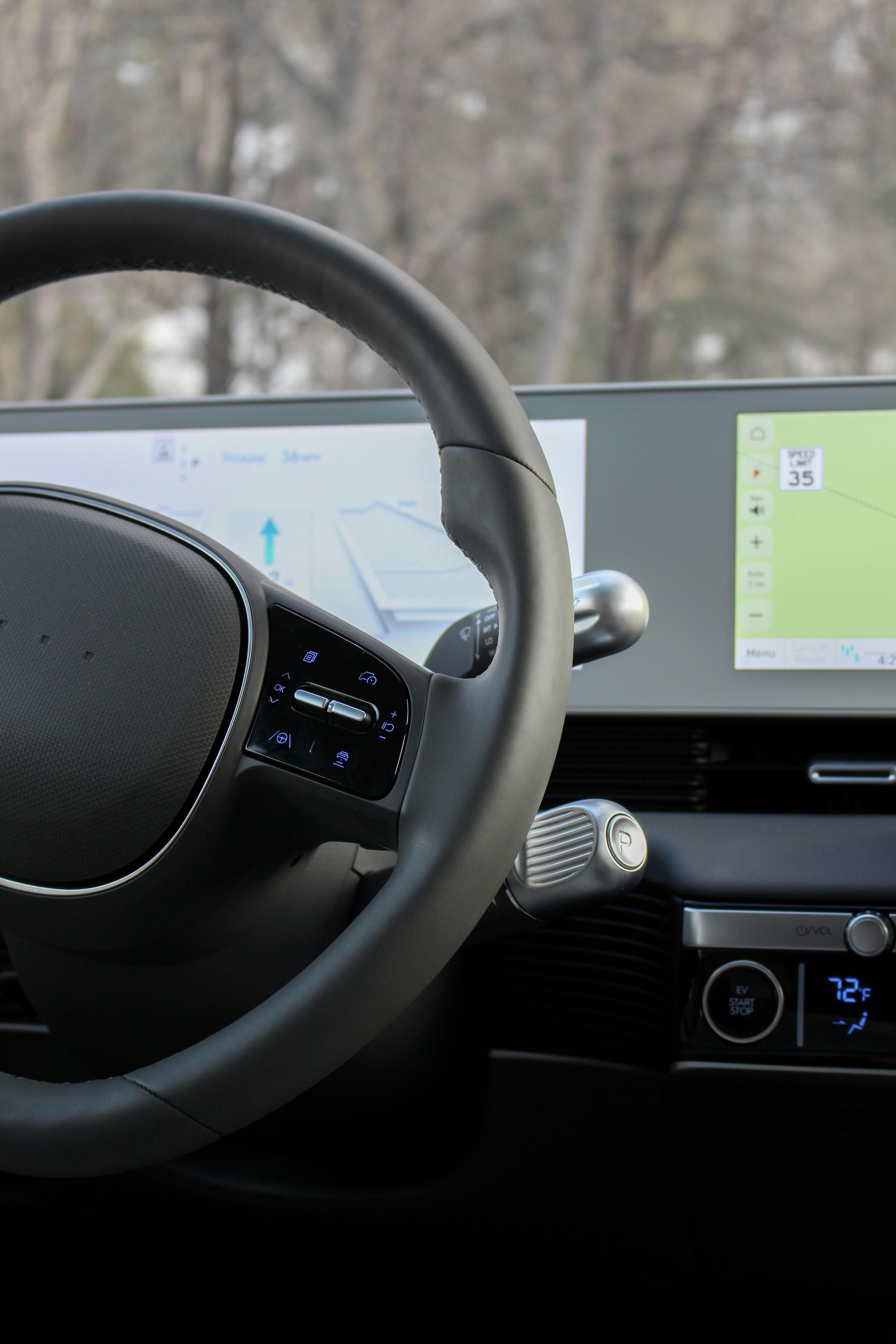 A car dashboard with a monitor and steering wheel photo – Free Car ...