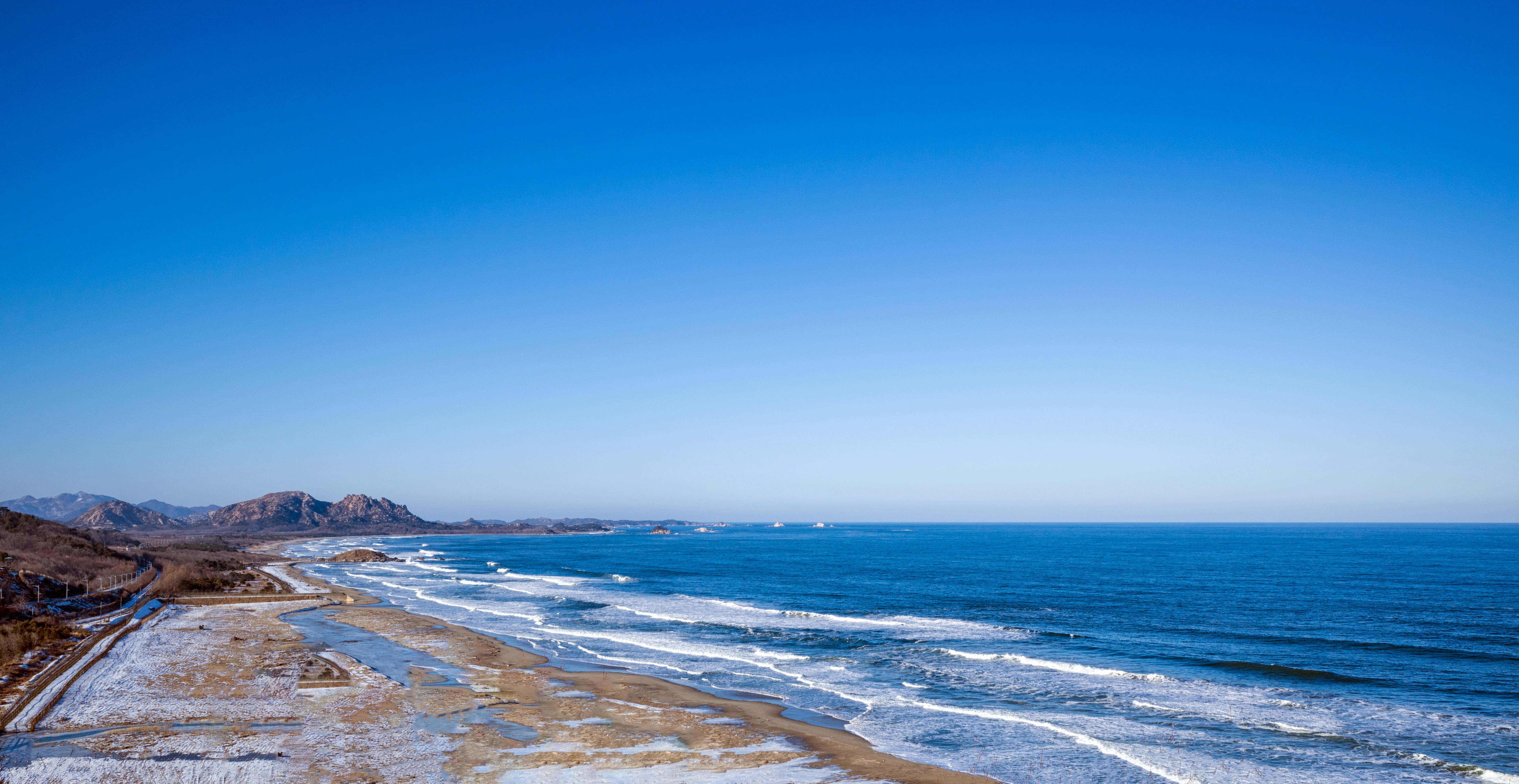 Blue Horizon Over Wind-Swept Dunes