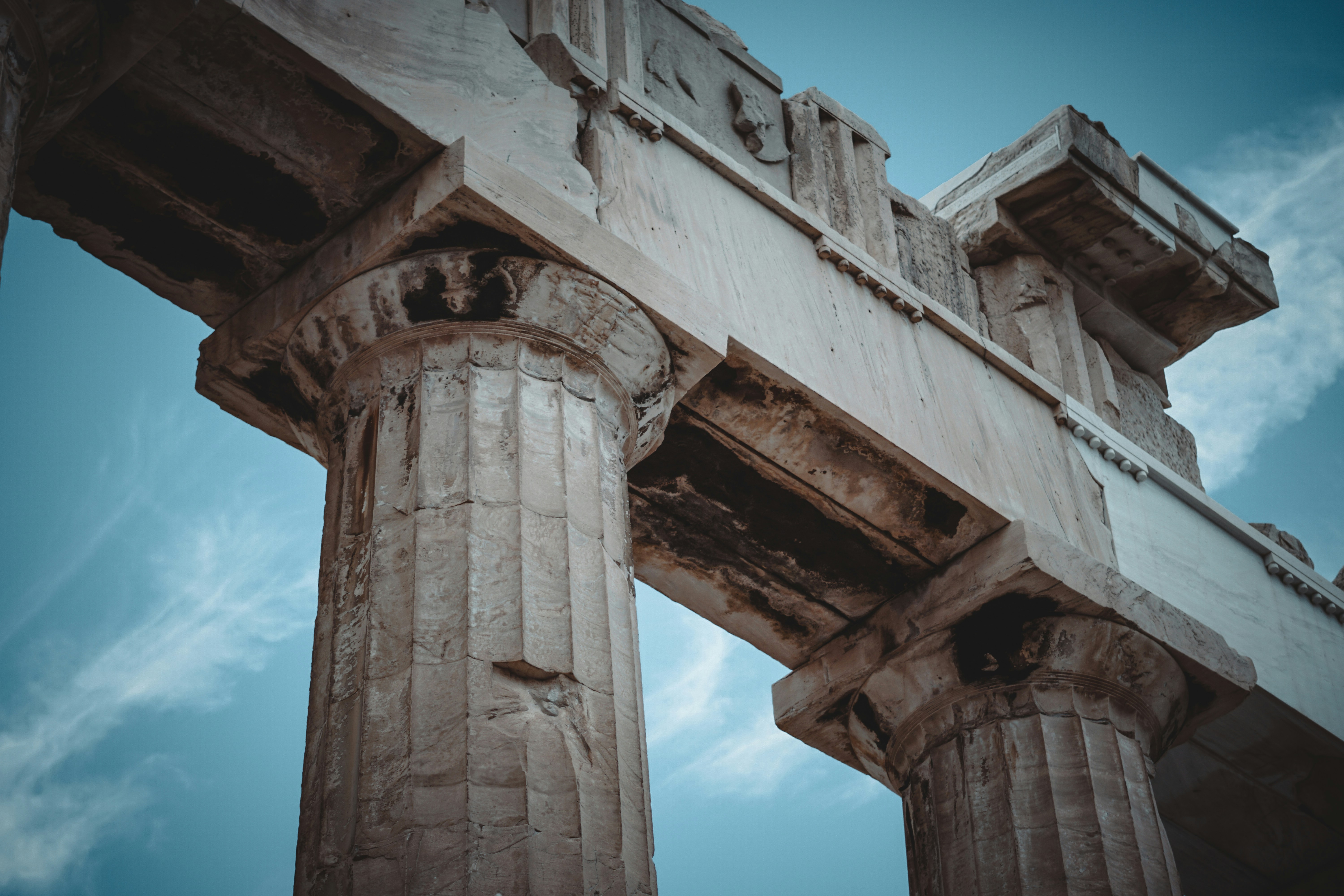 A close up of a stone structure with columns photo – Free Atenas Image ...