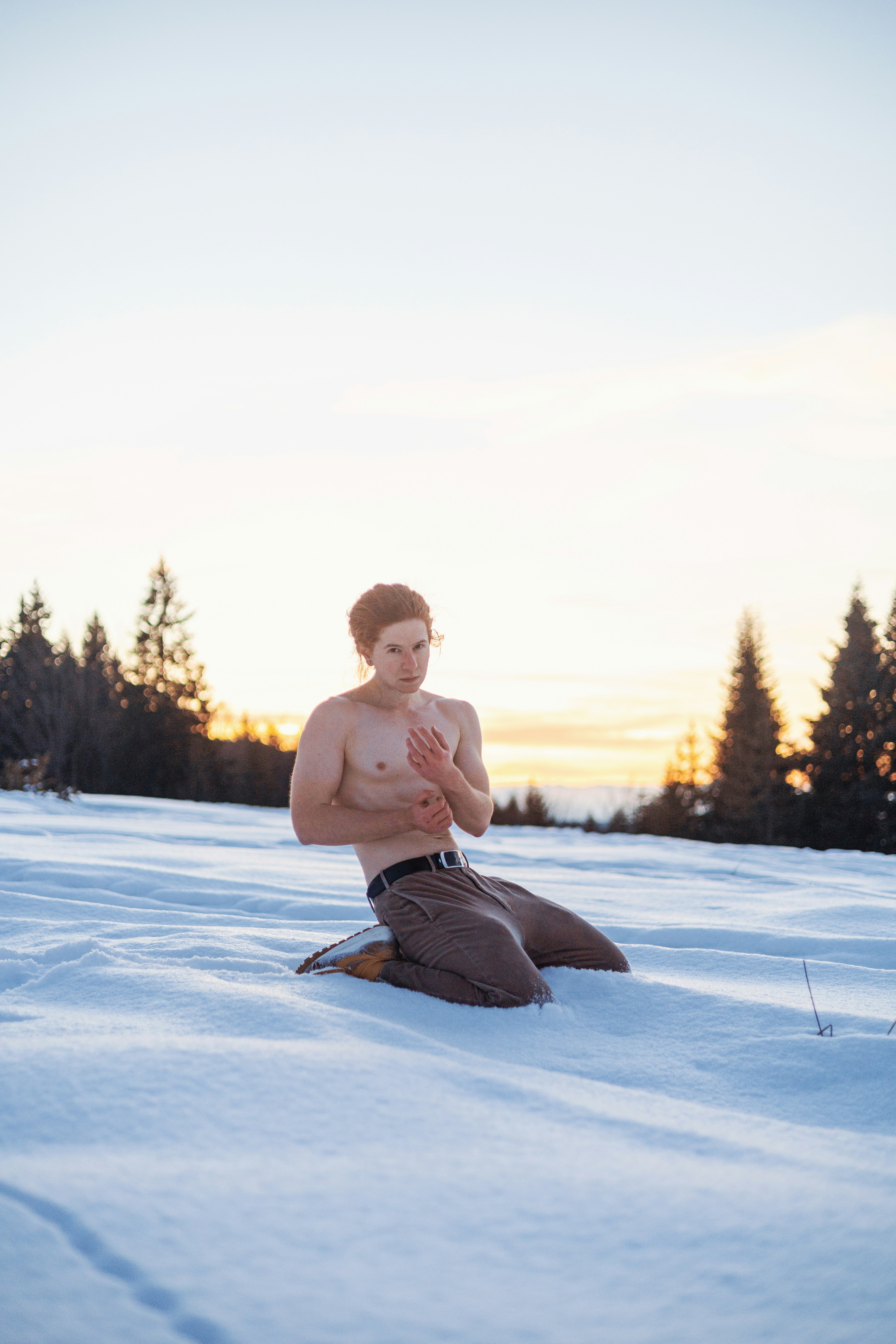 A Shirtless Man Sitting In The Snow Photo Free Male Image On Unsplash